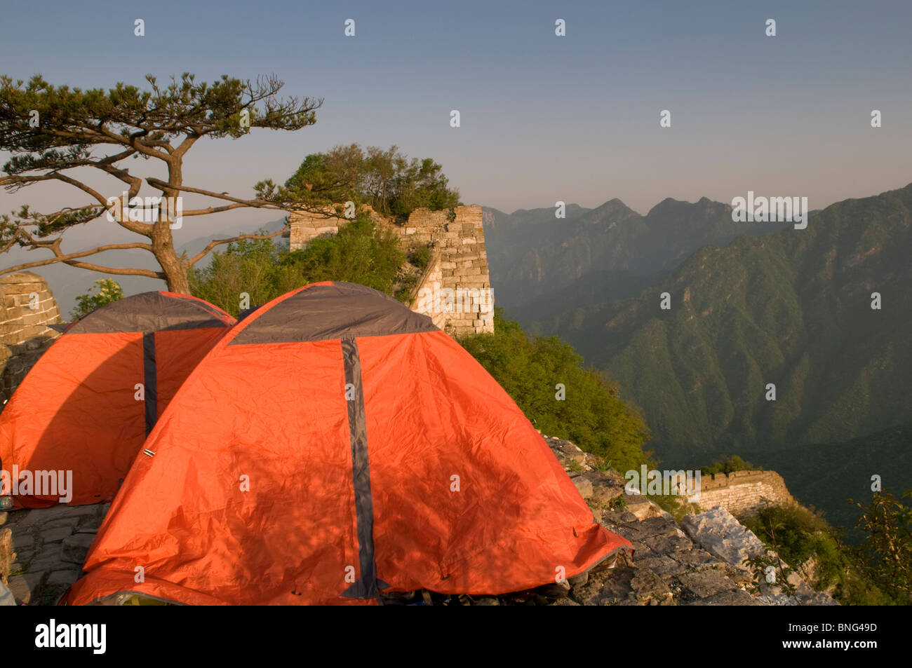 Camping on the wild wall portion of the Great Wall of China Stock Photo ...
