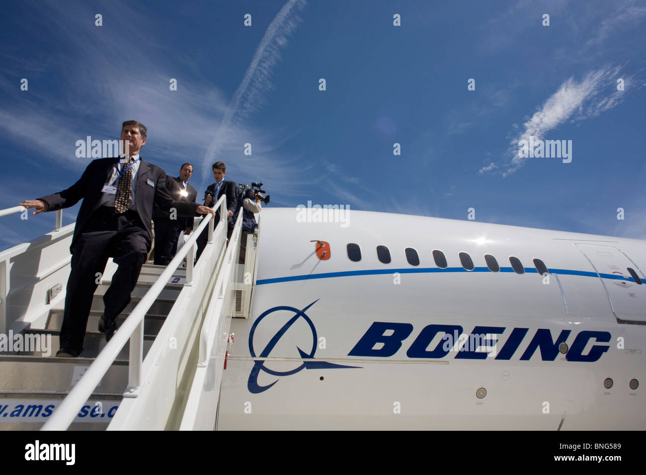 Media descend steps of the Boeing-manufactured 787 Dreamliner (N787BX ...