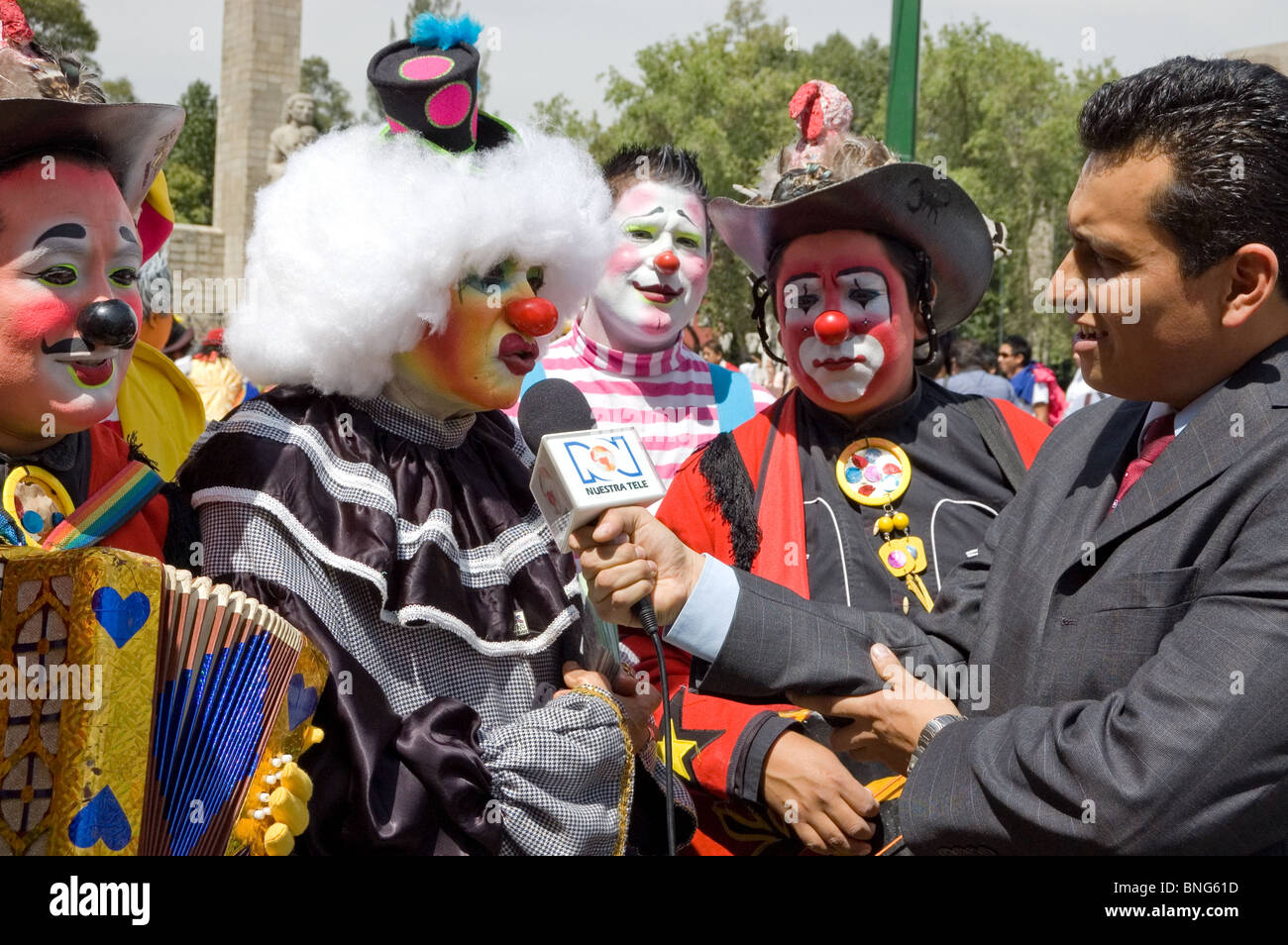 Clowns being interviewed during a clown parade in Mexico city with ...