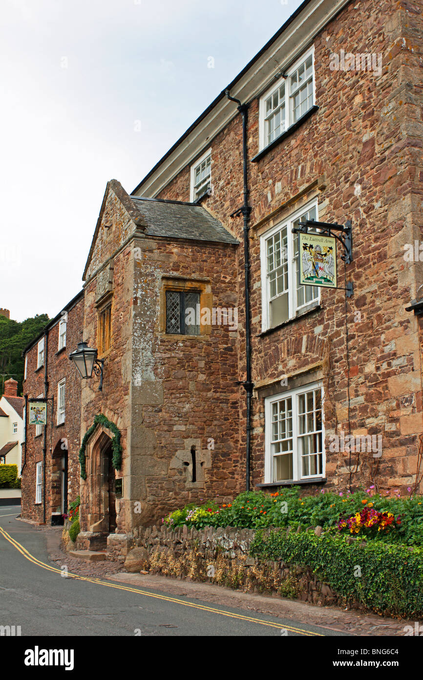 The historic ancient Luttrell Arms Hotel in the main street of the town ...
