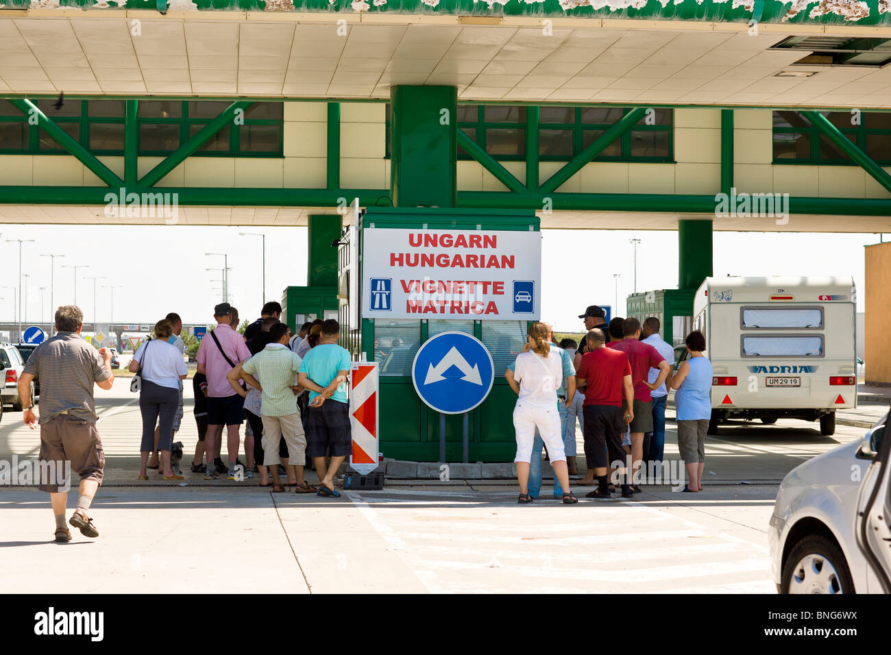 Travelers in front of a hungarian road toll booth at the Slovakian ...