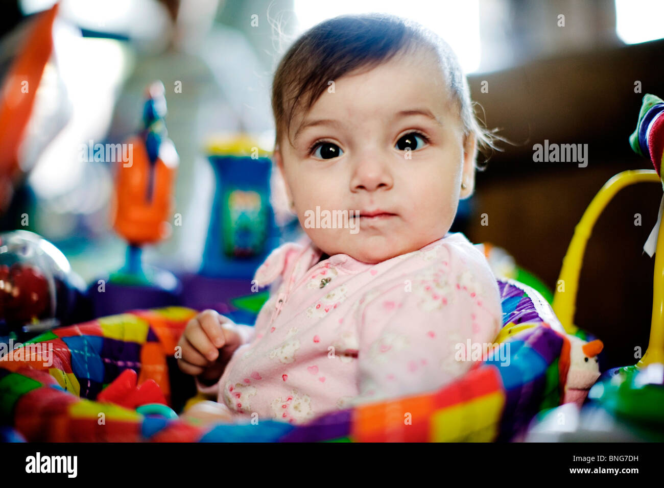 Baby in a walker Stock Photo - Alamy