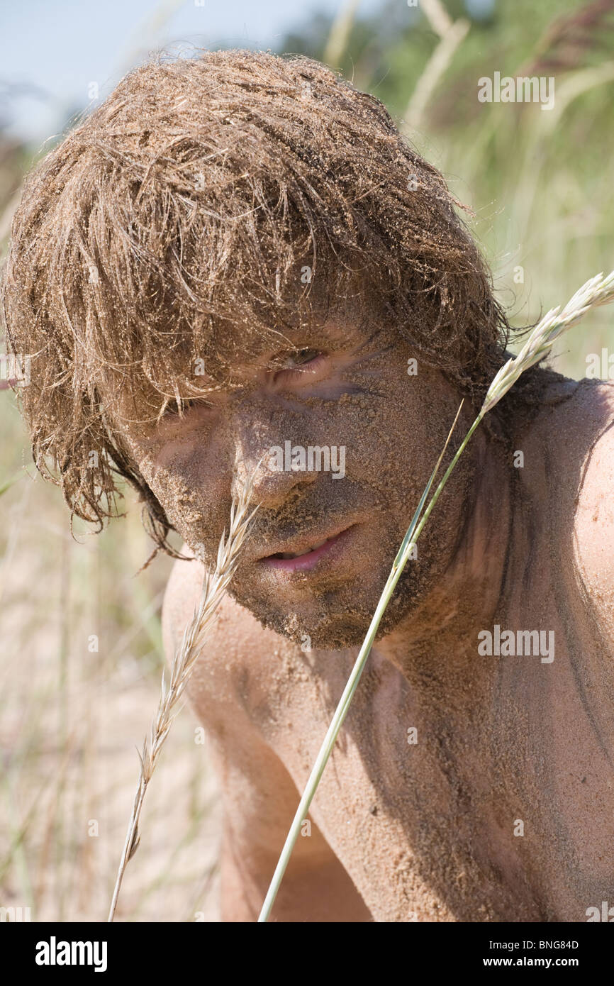 man face under sand layer, portrait closeup Stock Photo - Alamy