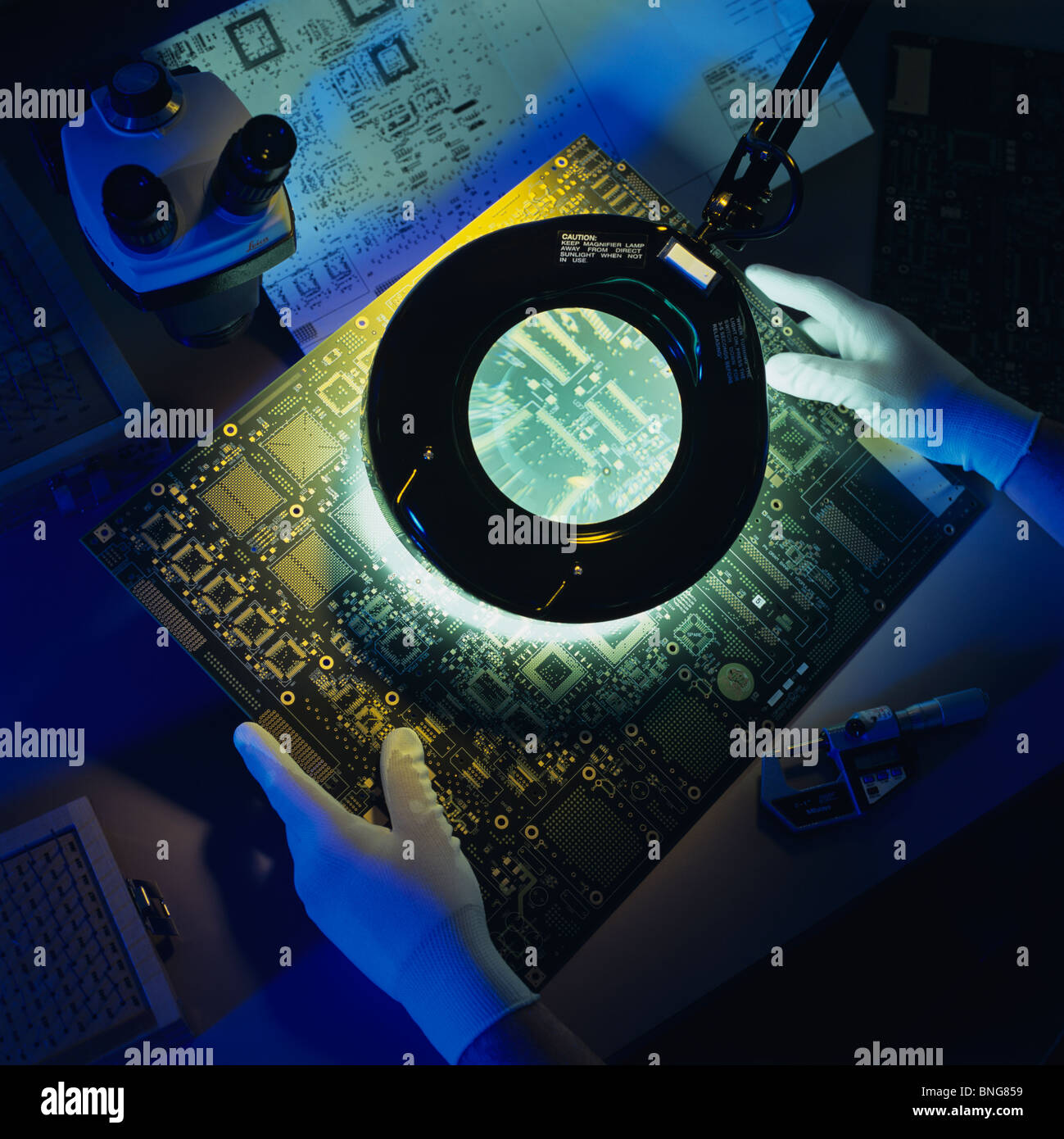 Circuit Board Under Magnifying Glass Stock Photo - Alamy