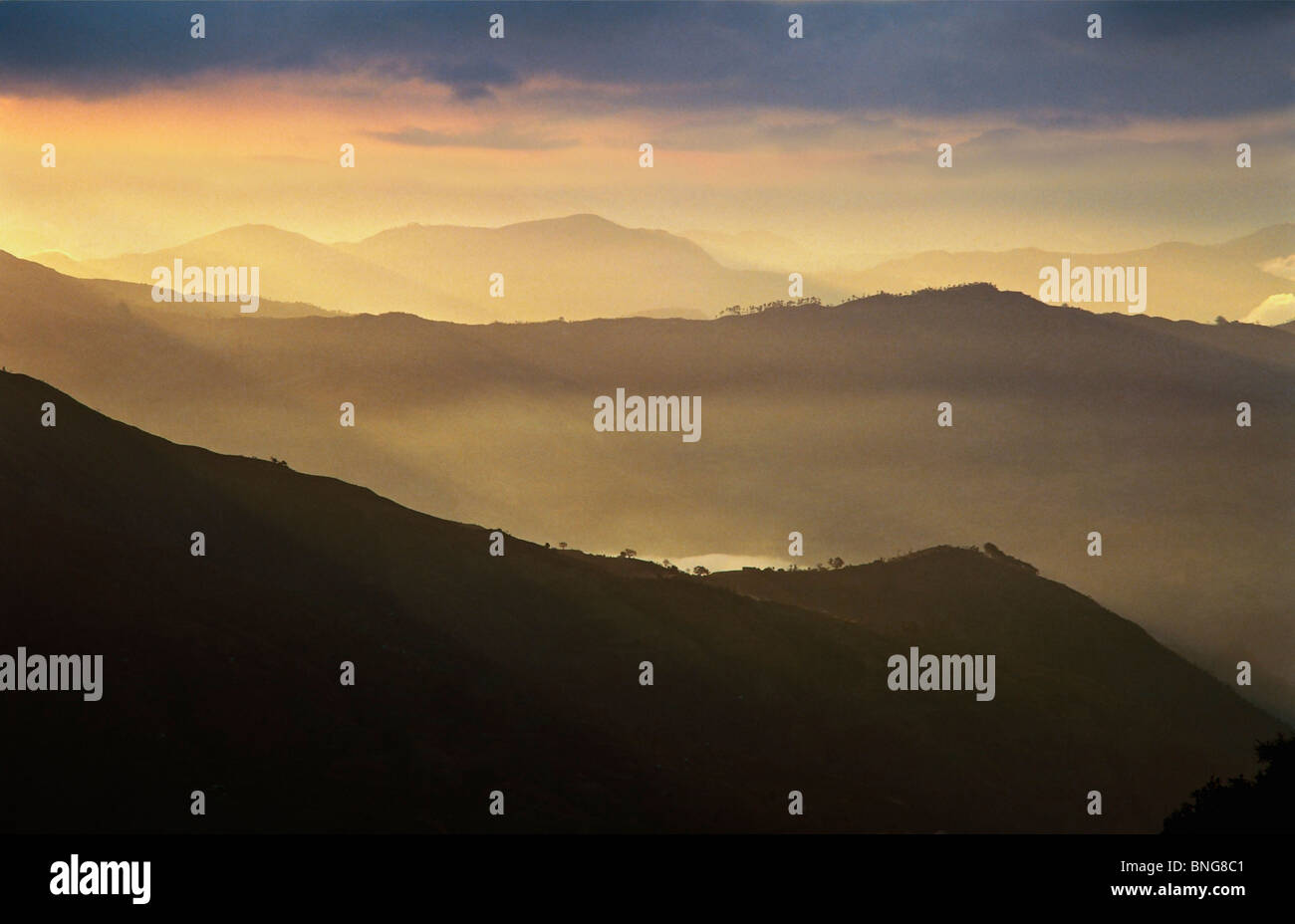 Dawn over ridges of foothills at Ghul Bhanjyang in the Helambu region ...
