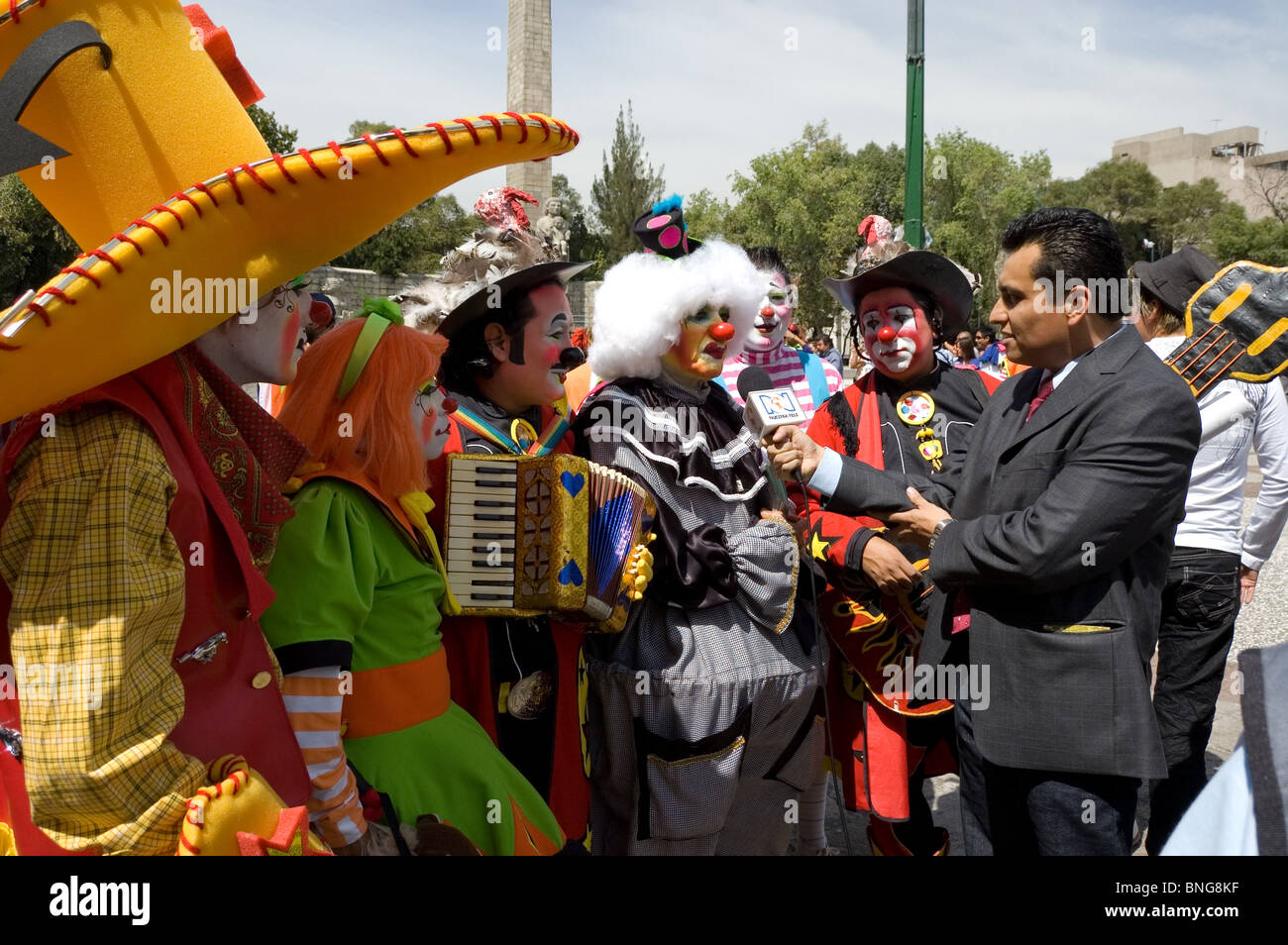 Clowns being interviewed during a clown parade in Mexico city with ...