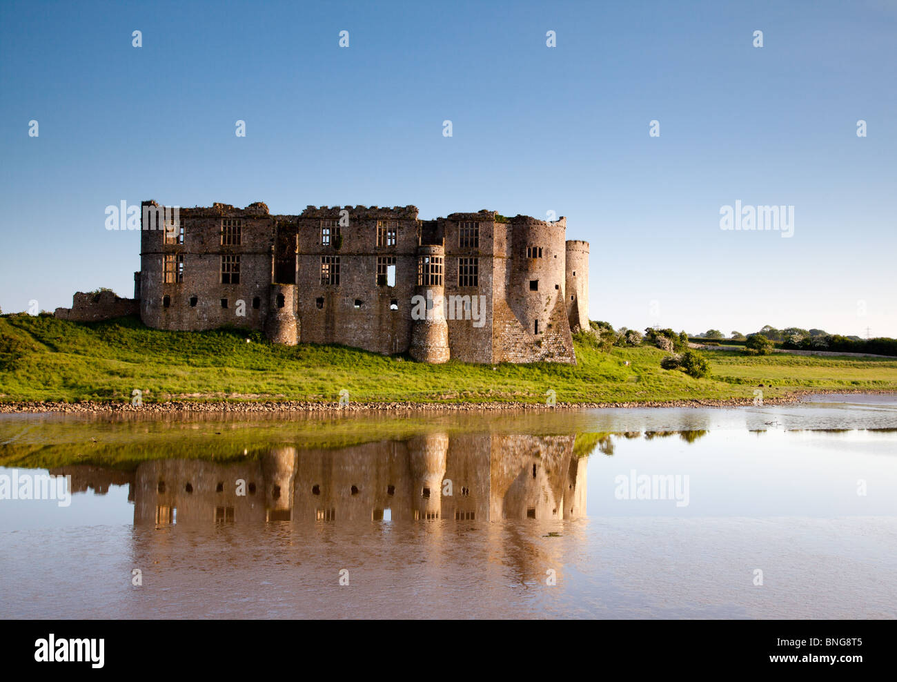 A summer evening photograph of Carew Castle, wales, with the castle ...