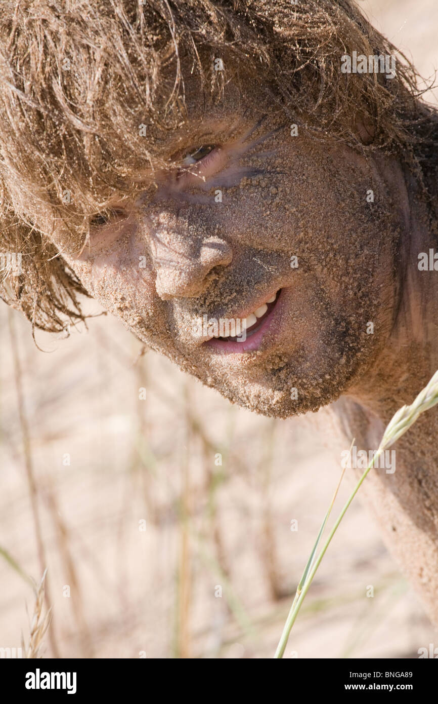 portrait of man under sand layer, face closeup Stock Photo - Alamy