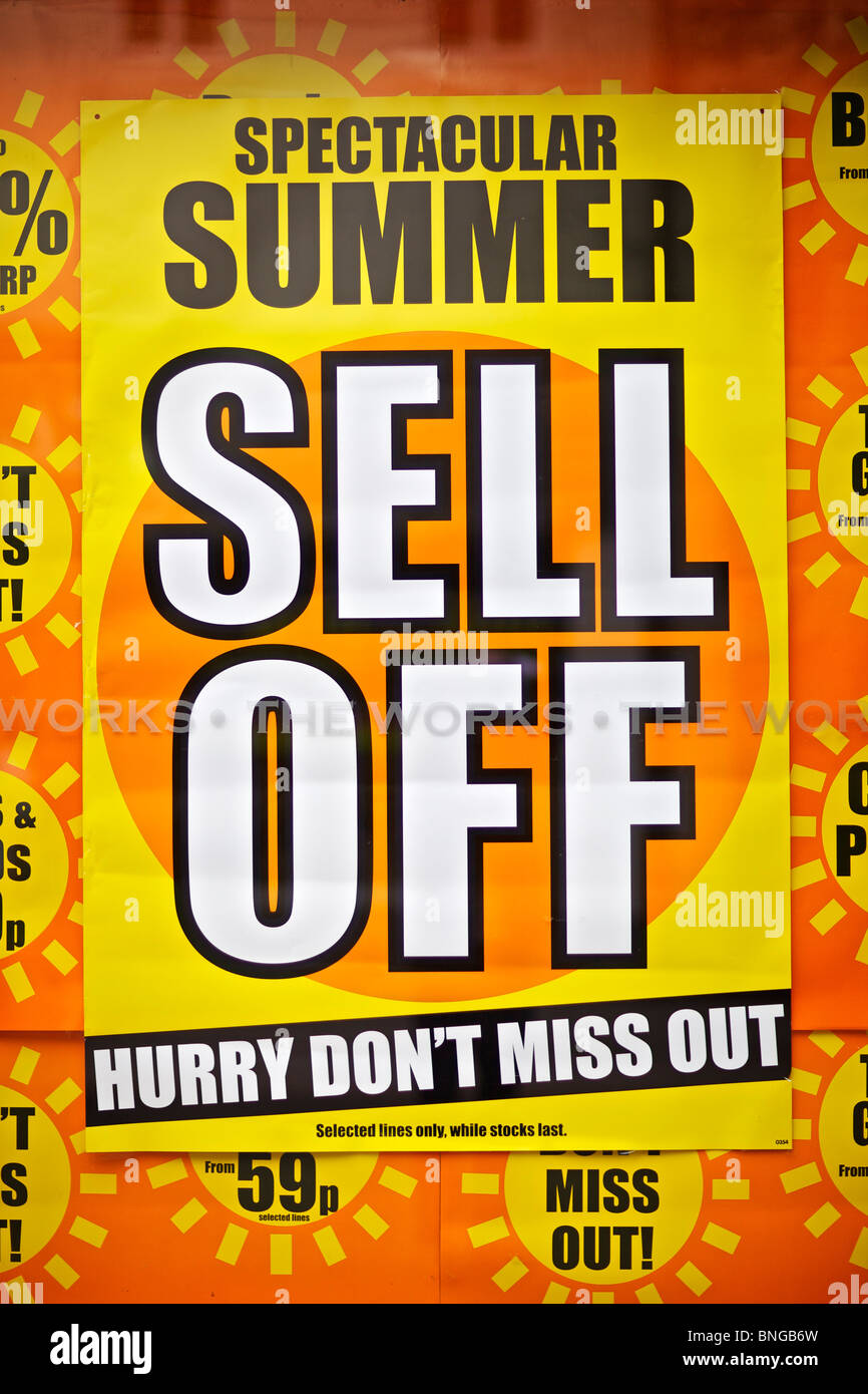 Summer sale poster in shop window on High Street Stock Photo - Alamy