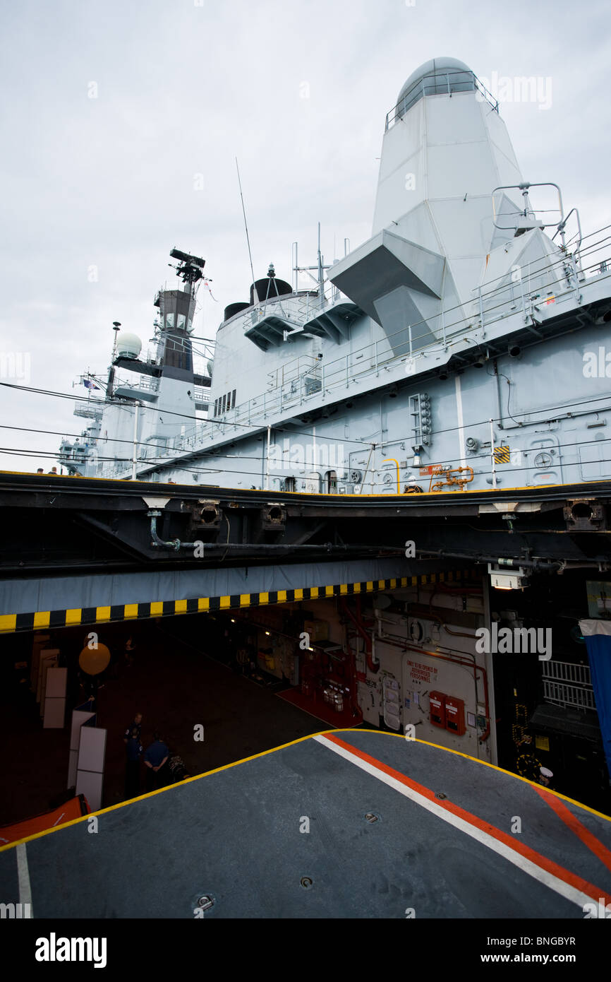 Partially lowered elevator platform on Royal Navy aircraft carrier HMS ...
