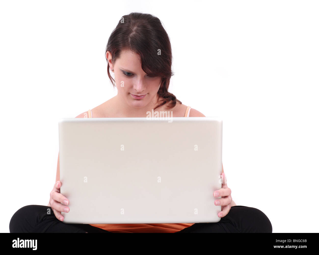 Portrait of teenage girl sitting and holding laptop Stock Photo - Alamy