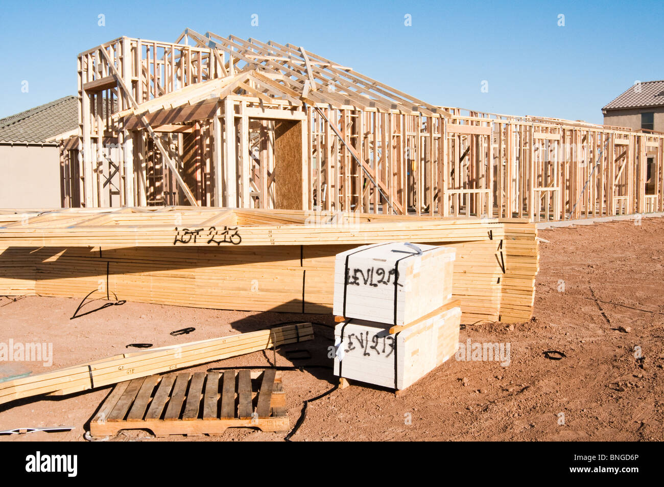 Building materials are stacked on the construction site for a new wood ...