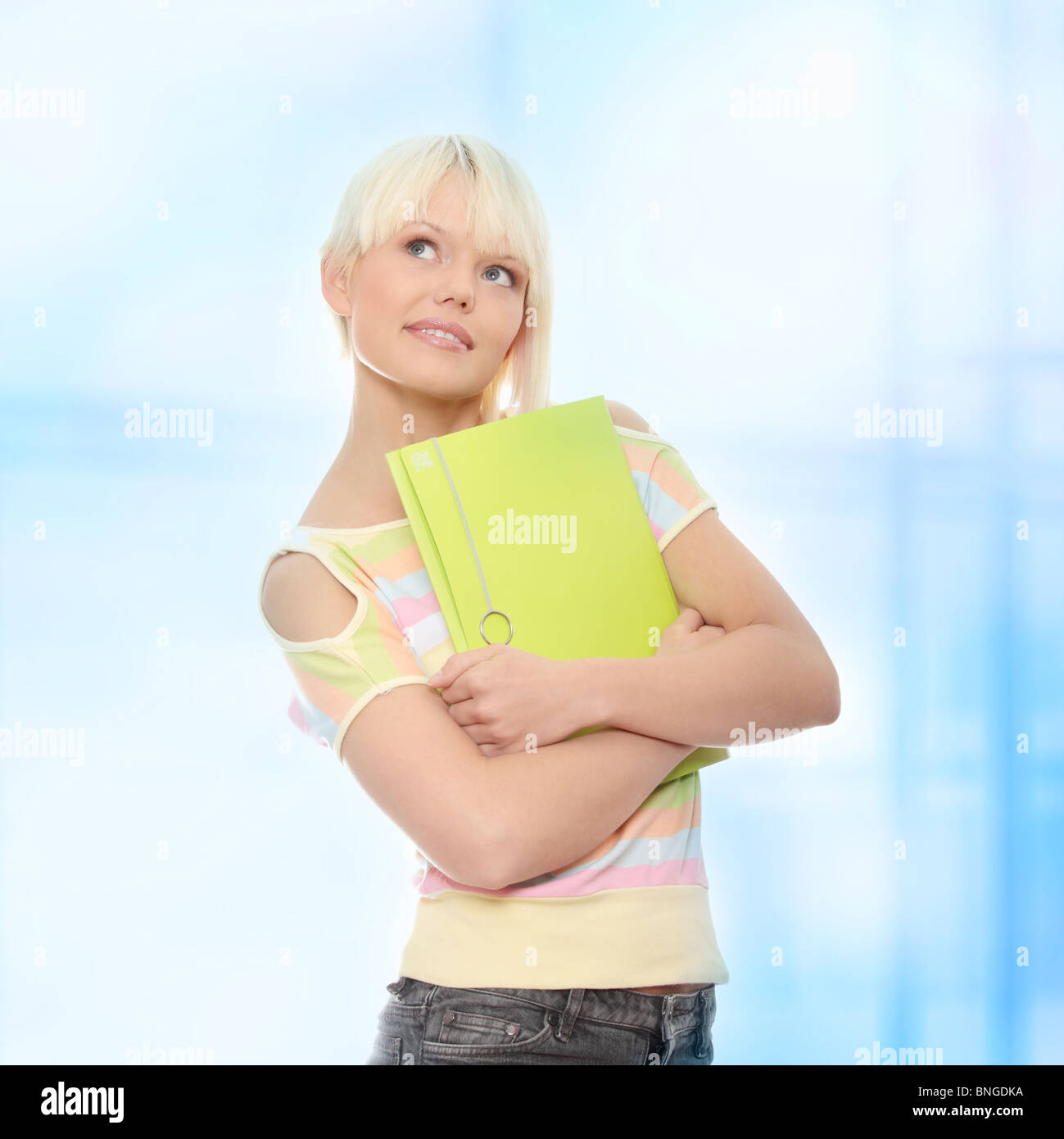 Beautiful smiling woman. Over abstract blue background Stock Photo - Alamy