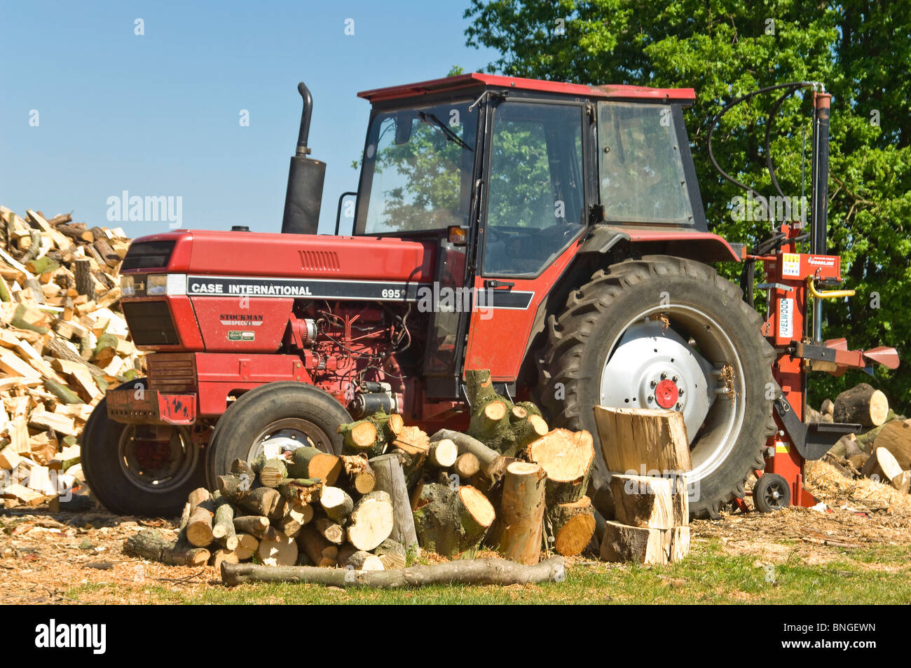 Horizontal close up of a bright red Case International tractor parked ...