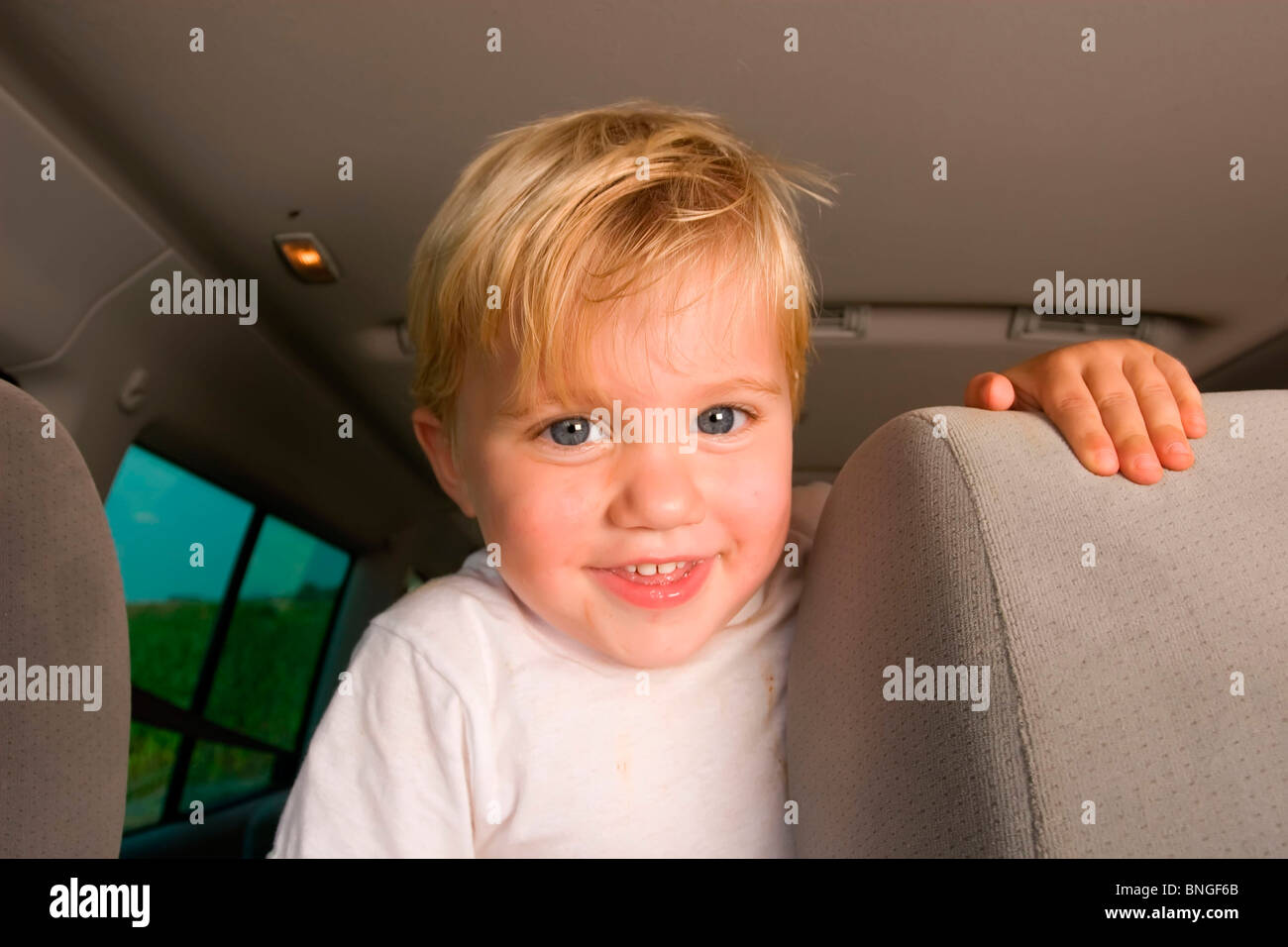 Baby boy playing in a mini van Stock Photo - Alamy