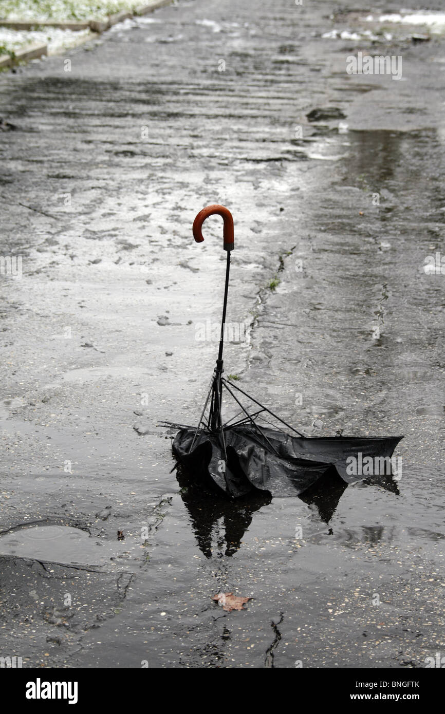 Broken umbrella on ground hi-res stock photography and images - Alamy