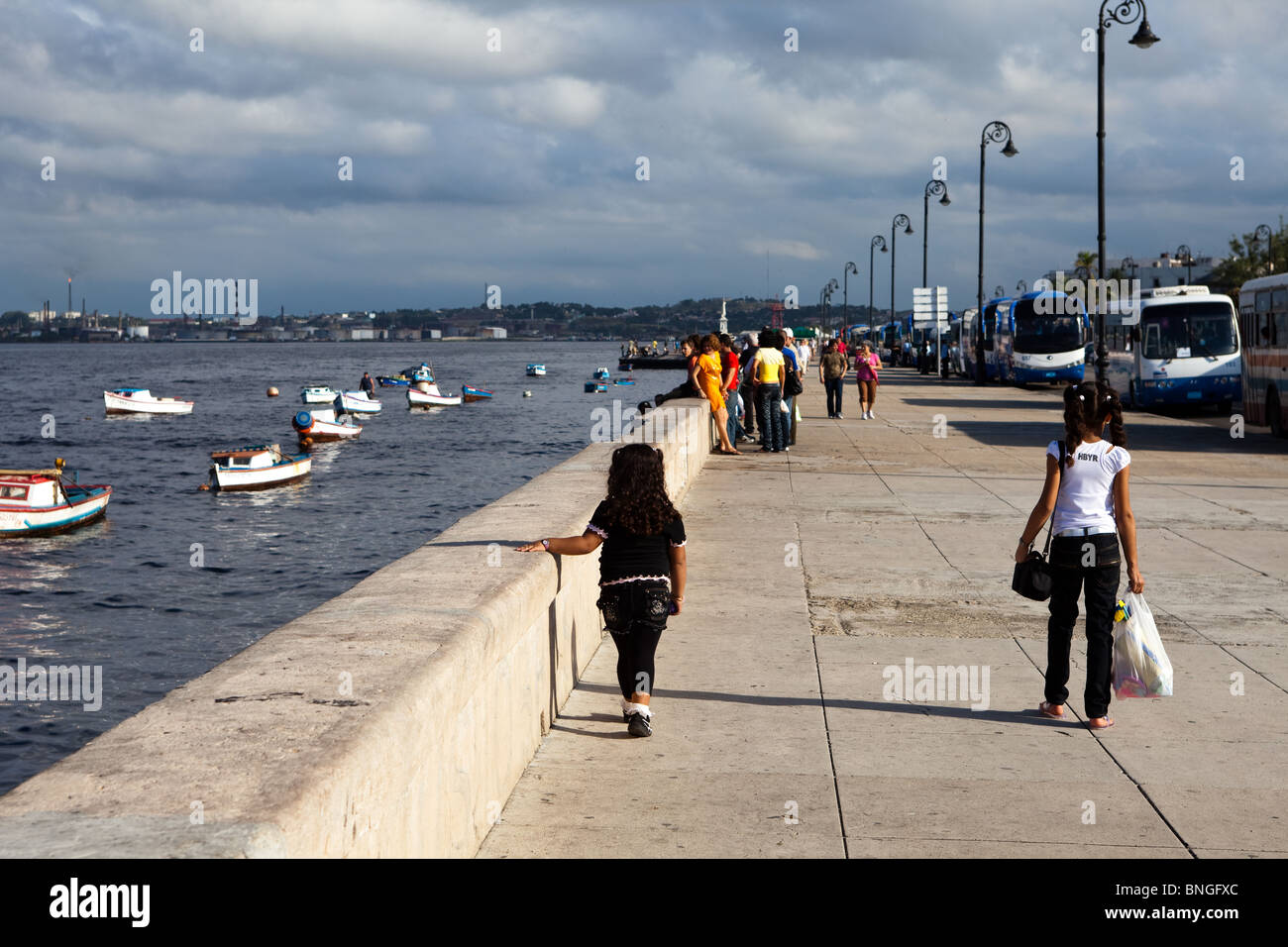 Girls walking along the Malecon seafront Havana Cuba Stock Photo - Alamy