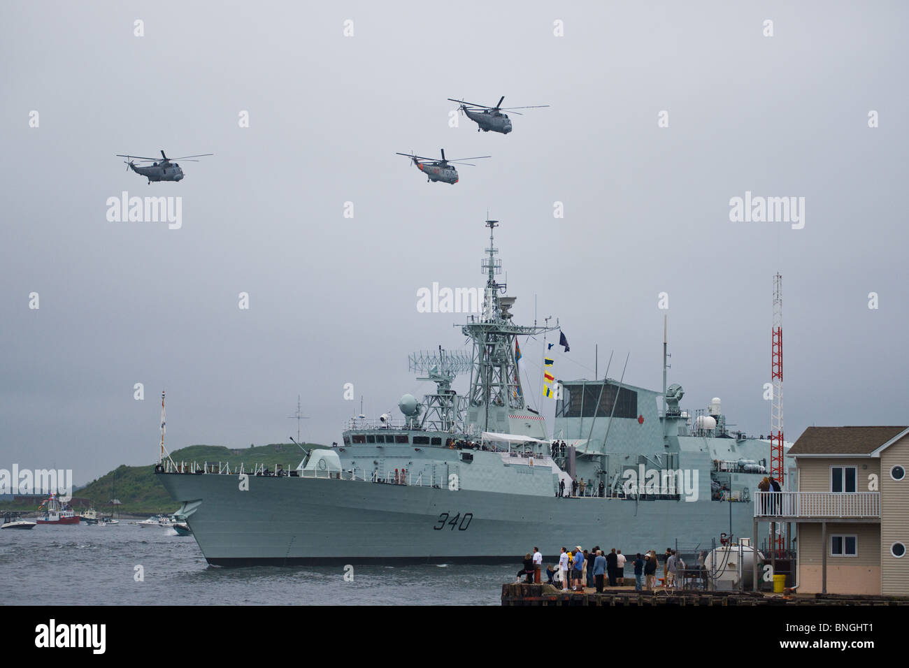 Sea King helicopters fly over as HMCS ST. JOHN'S brings HM Queen ...