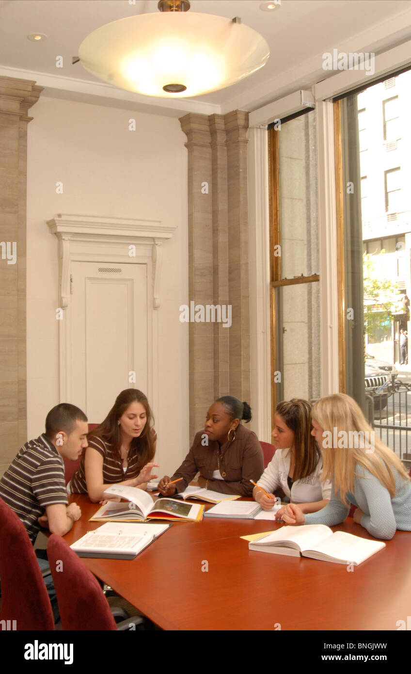 College students having a meeting in the university conference room ...
