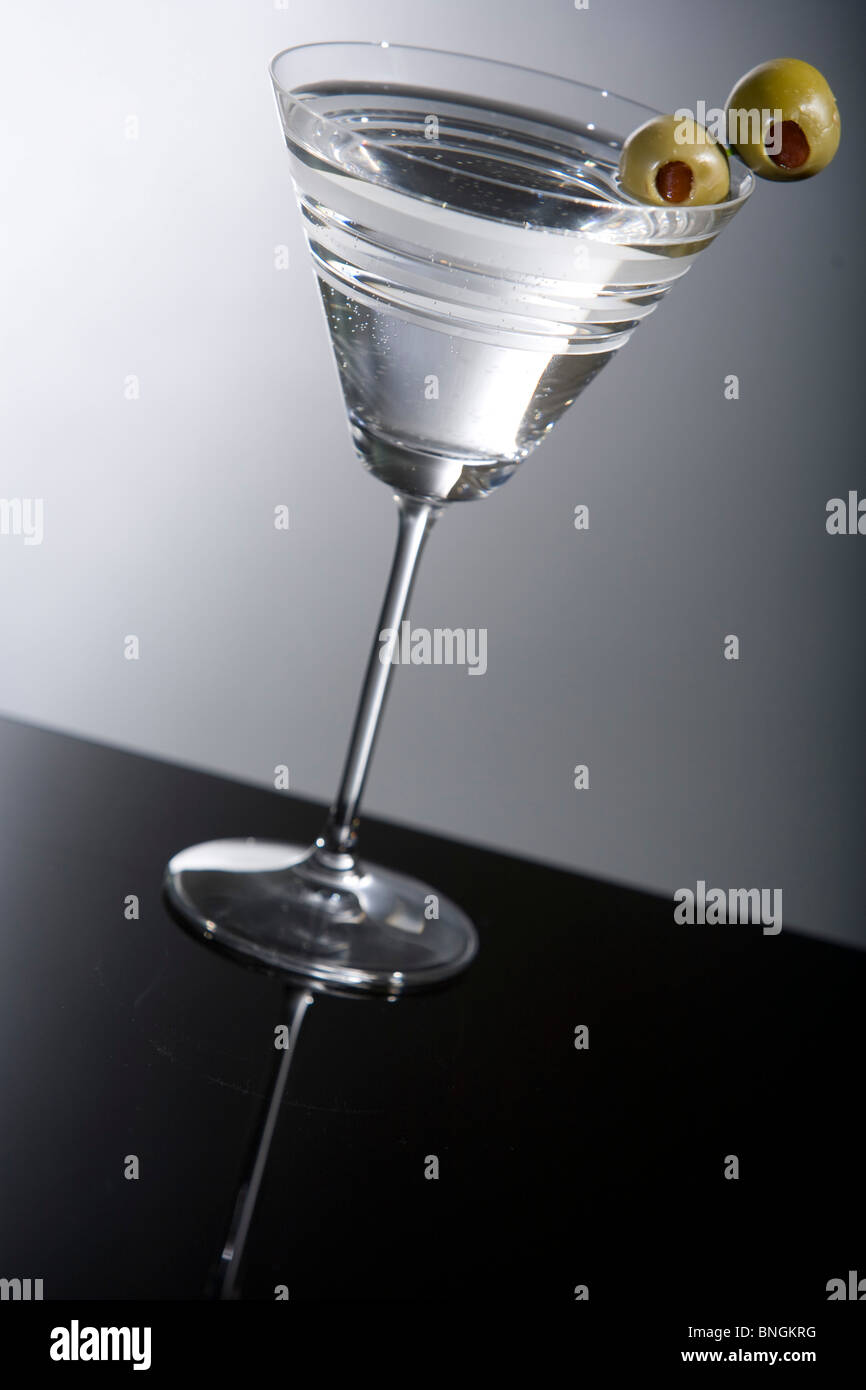 Martini with green olives Stock Photo - Alamy