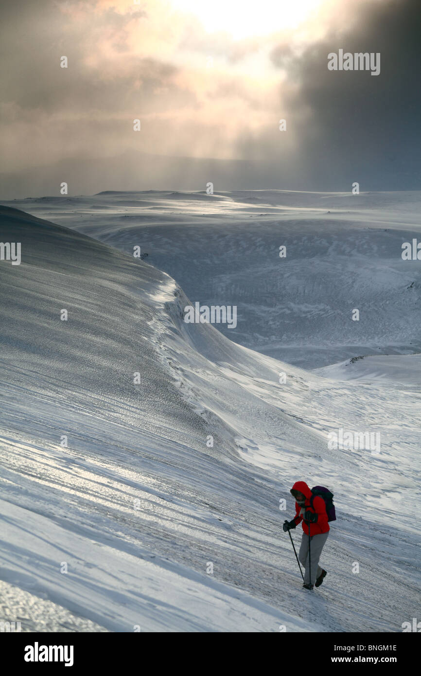 Hiker walking over ice landscape on an Icelandic volcano Stock Photo ...