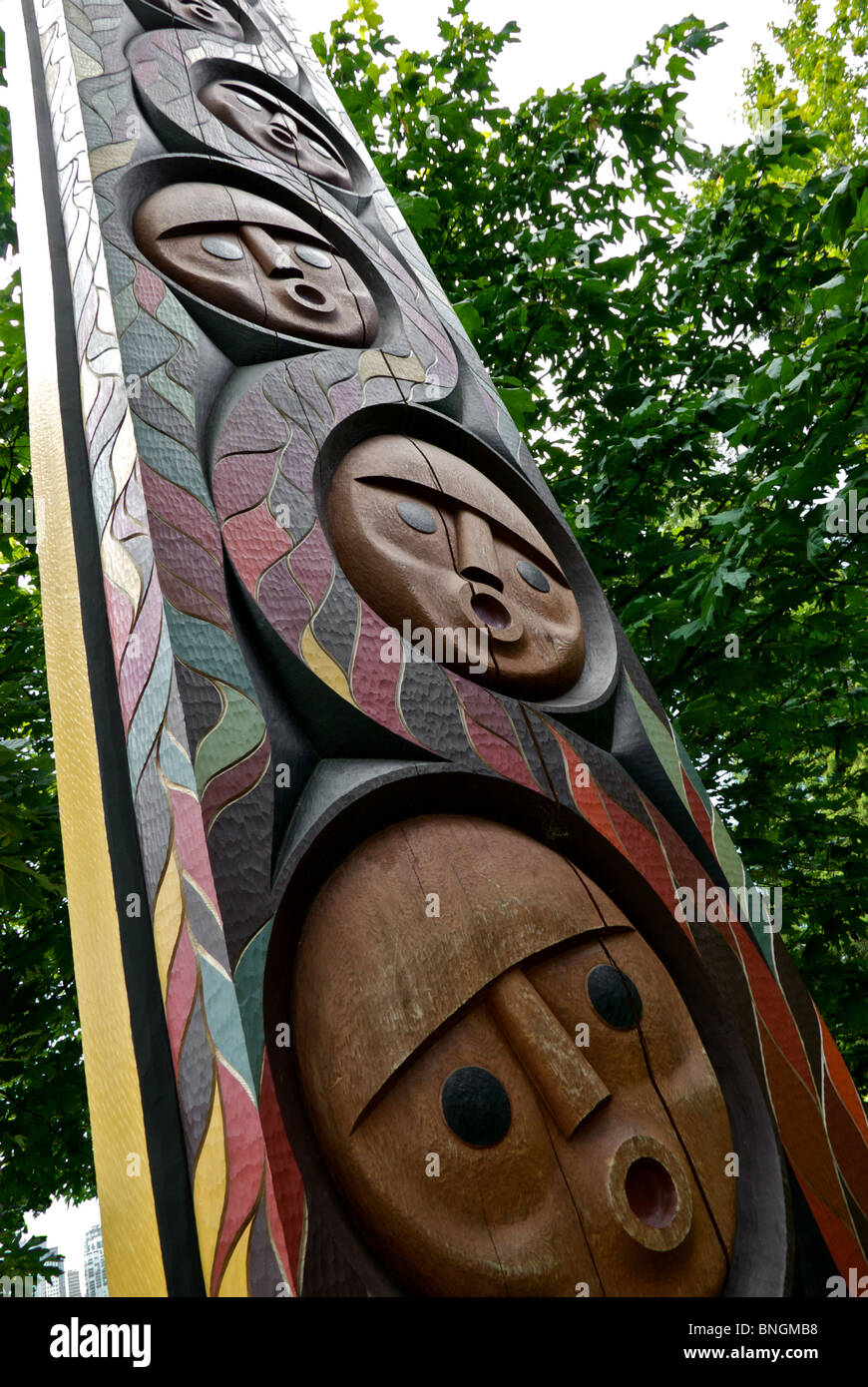 Intricately and ornately carved First Nations native design long house ...