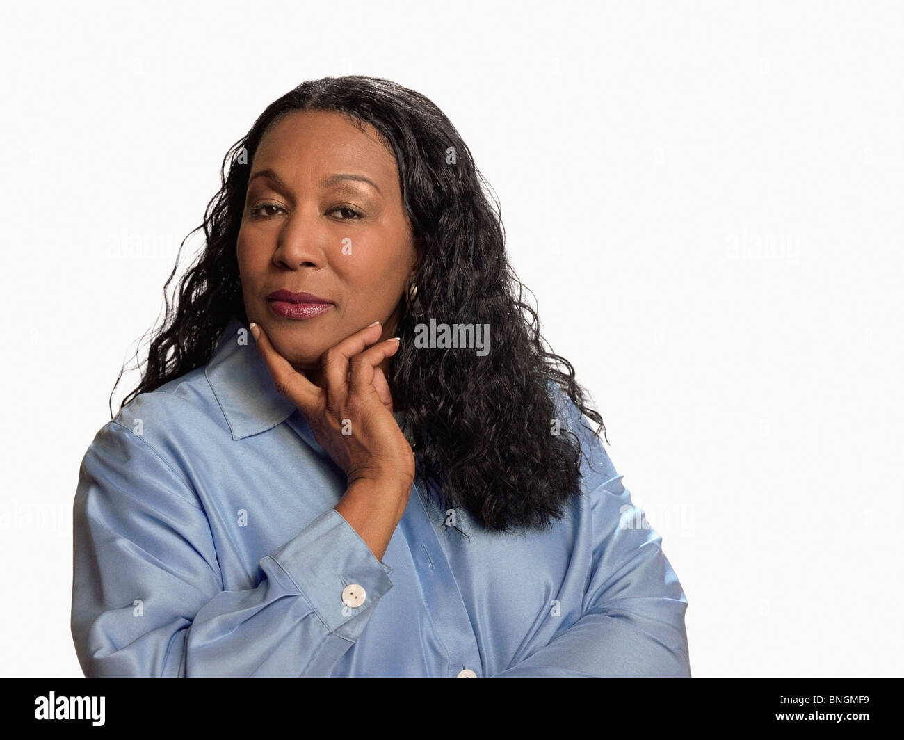 Portrait of a mature woman smirking Stock Photo - Alamy