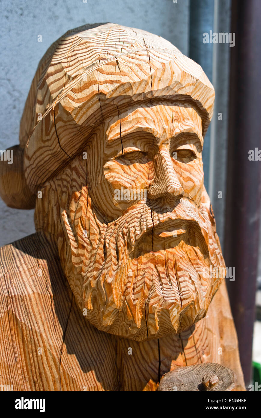 Old bearded man carved from wood Stock Photo - Alamy
