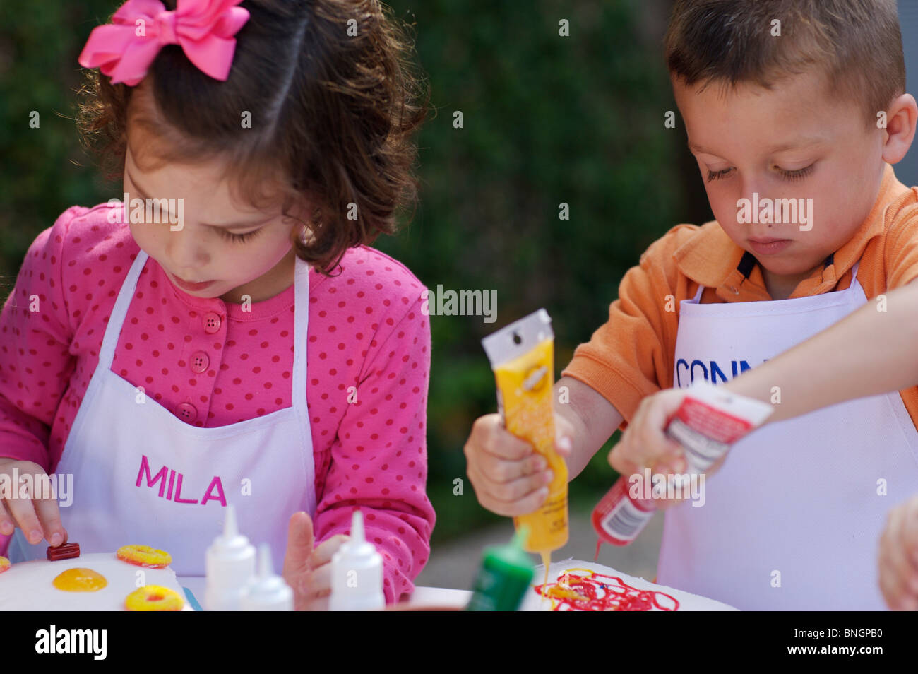 Boy and girl having fun at party Stock Photo - Alamy