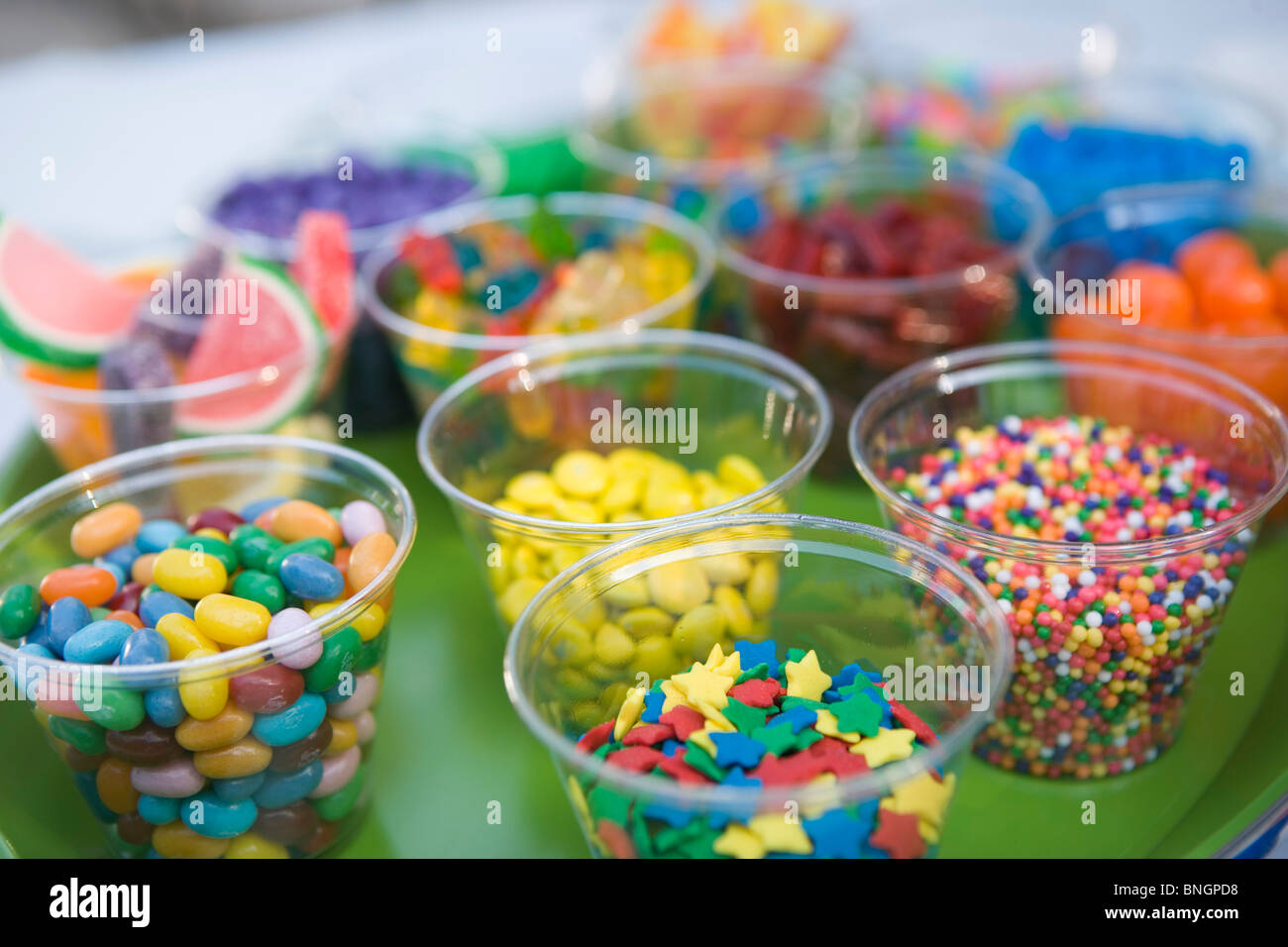 Tray full of candies in cups Stock Photo - Alamy