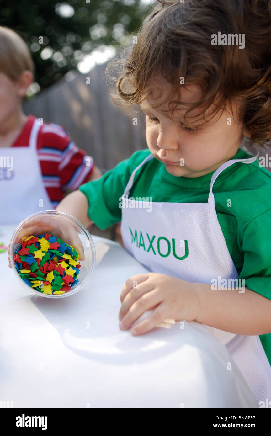 Young boy counting his candies Stock Photo - Alamy