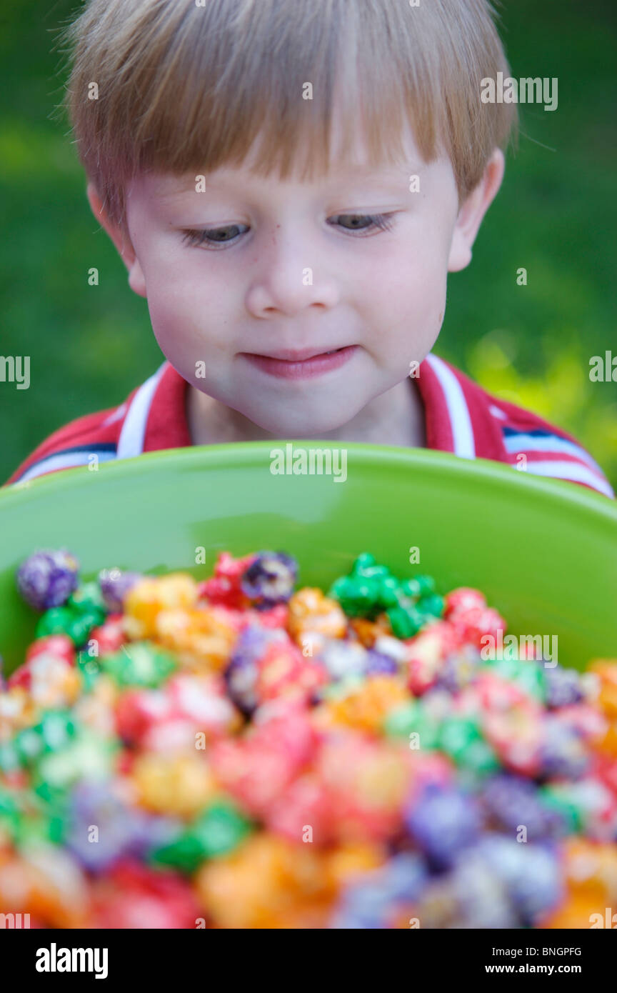 Young boy excited about popcorn Stock Photo - Alamy