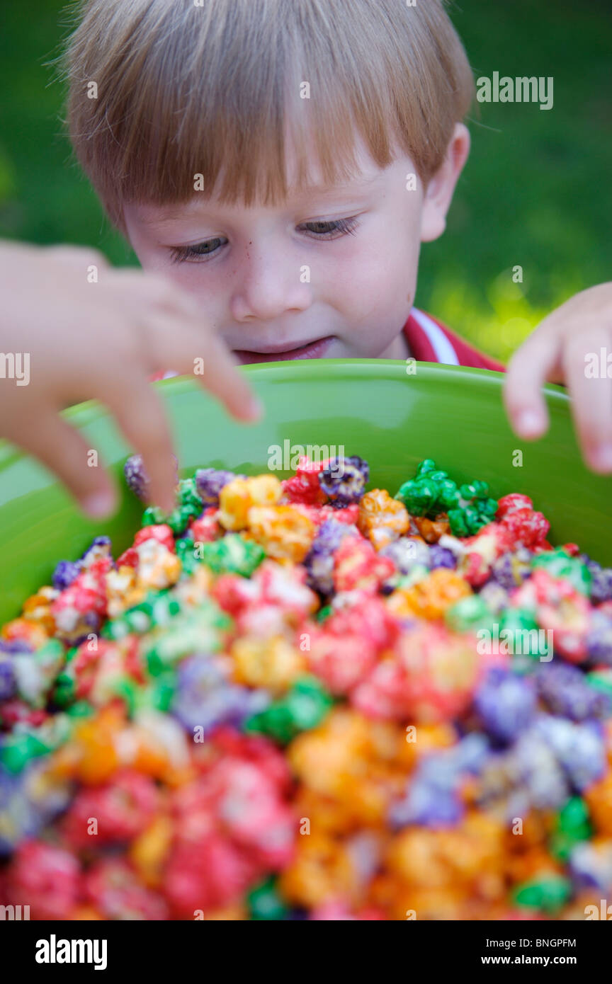 Reaching for popcorn hi-res stock photography and images - Alamy