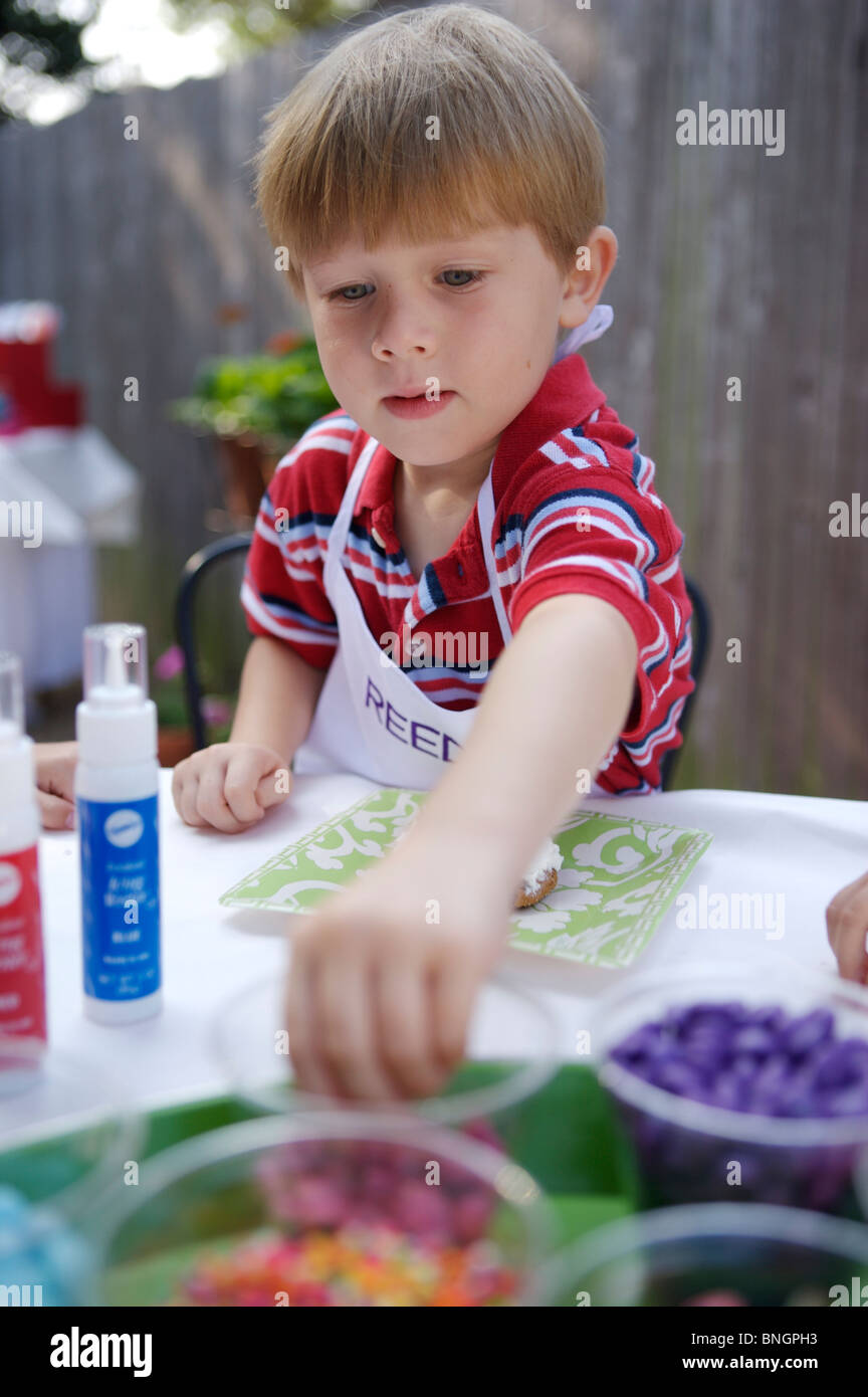 Kid reaching for candy hi-res stock photography and images - Alamy