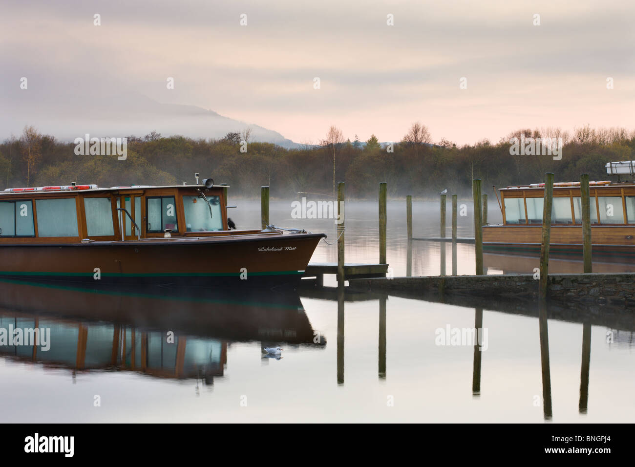 Lakeland Mist boat moored on Derwent Water on a frosty and misty autumn ...