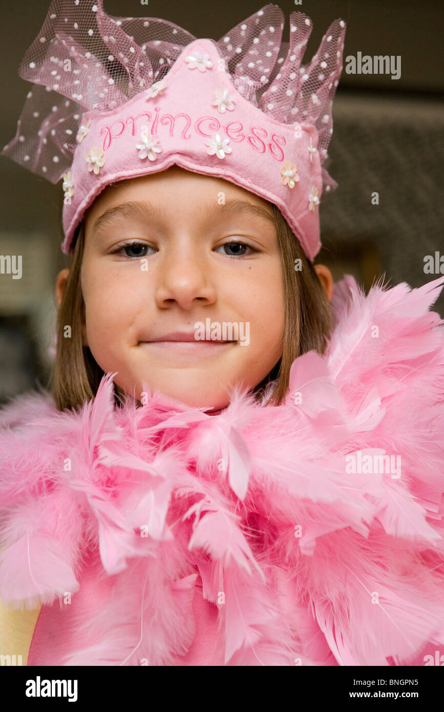 Girl wearing a pink feather boa on her birthday Stock Photo - Alamy