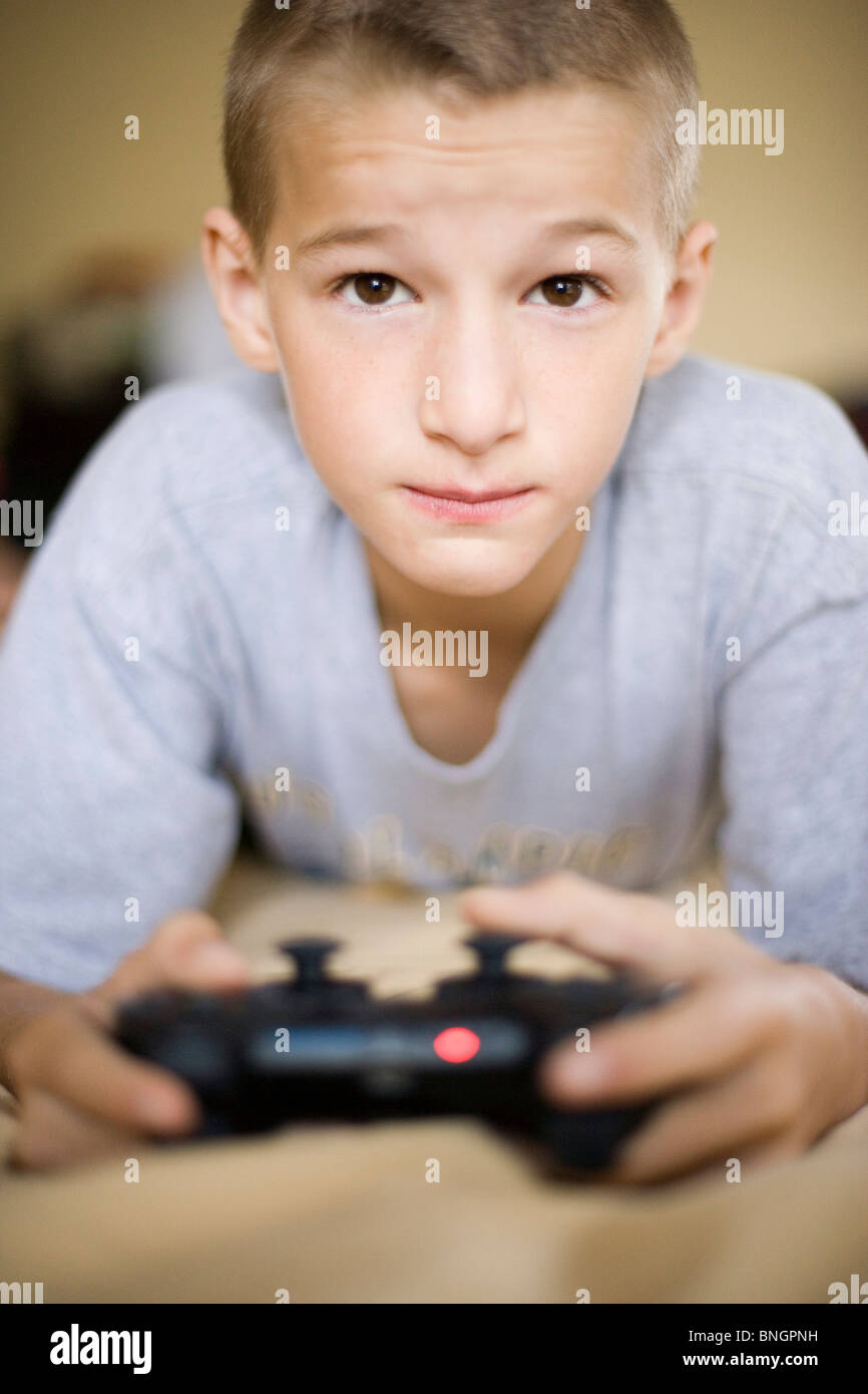 Boy playing a video game, Brazil Stock Photo - Alamy