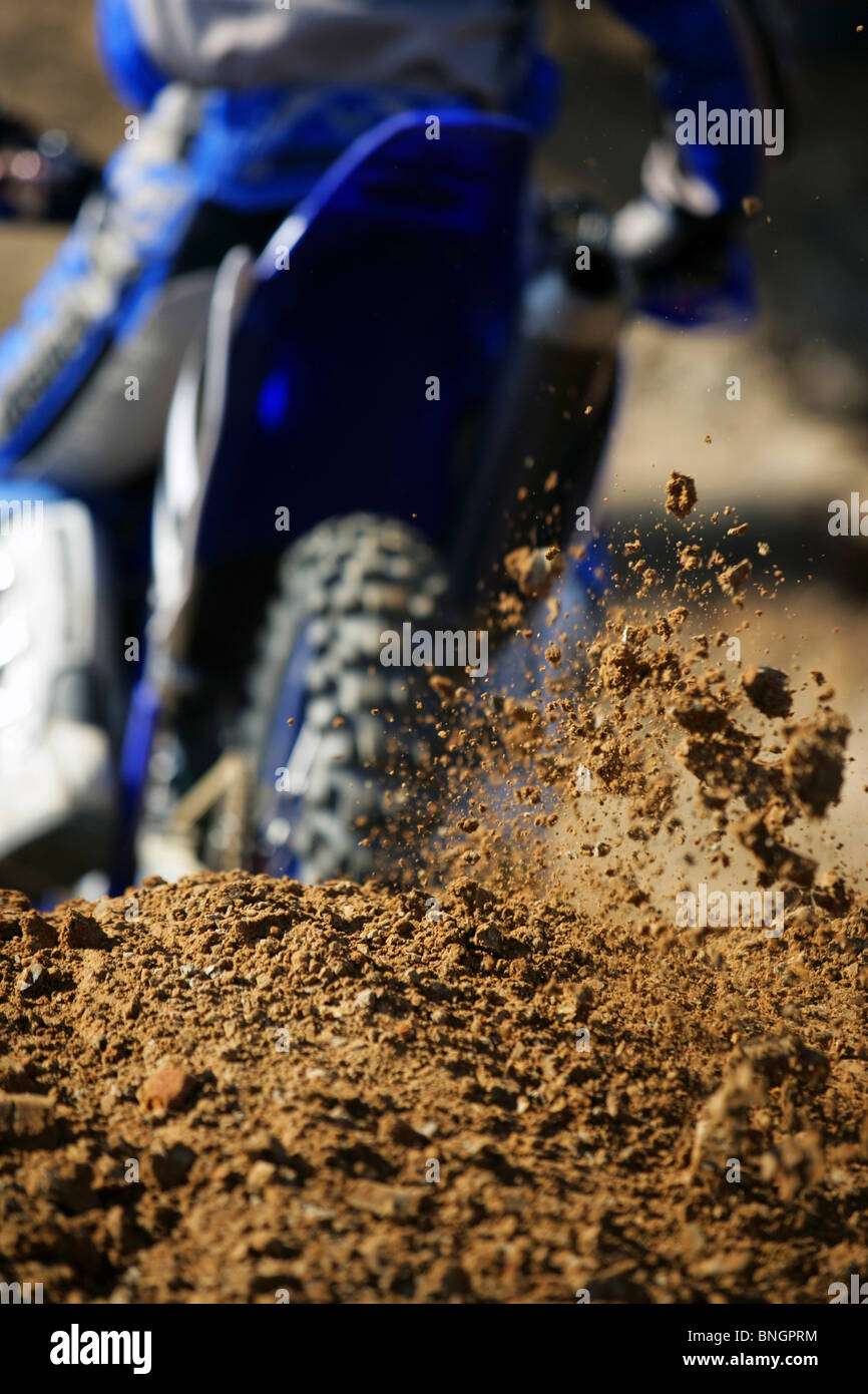 Dirt flying off the back of a dirt bike Stock Photo - Alamy