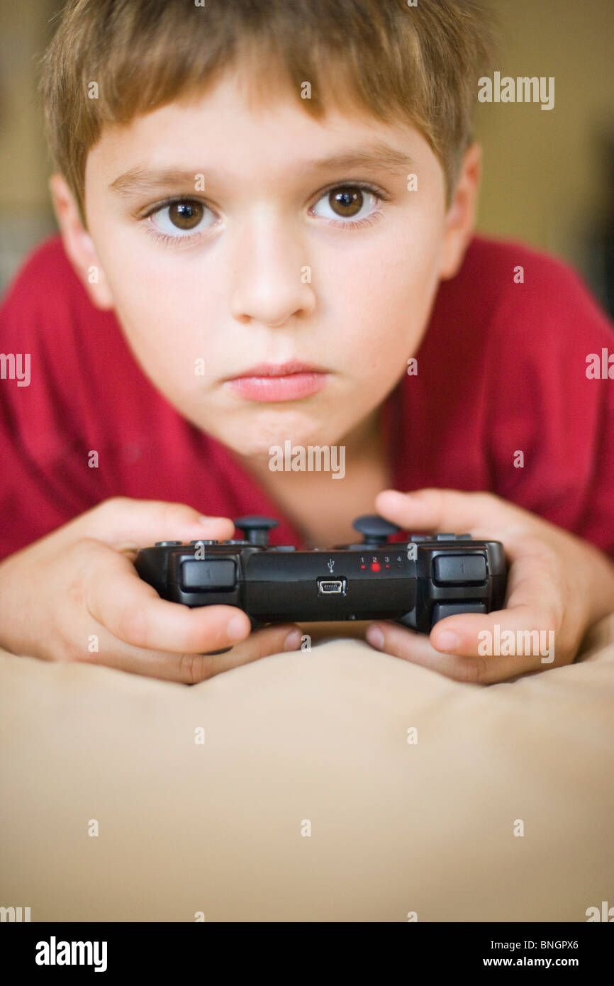 Boy playing a video game, Brazil Stock Photo - Alamy