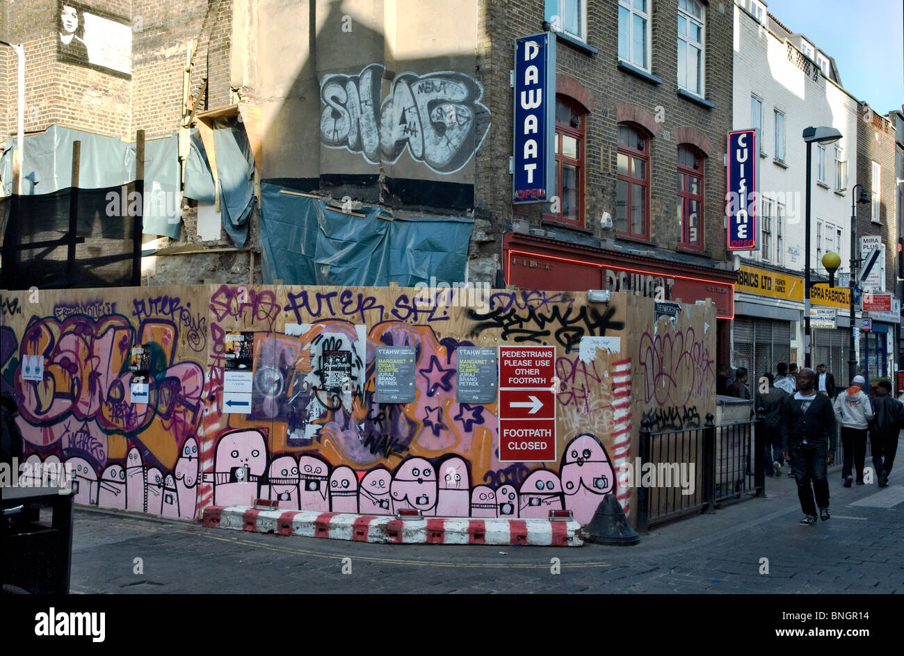 Street hording with graffitti in Brick Lane London Stock Photo - Alamy