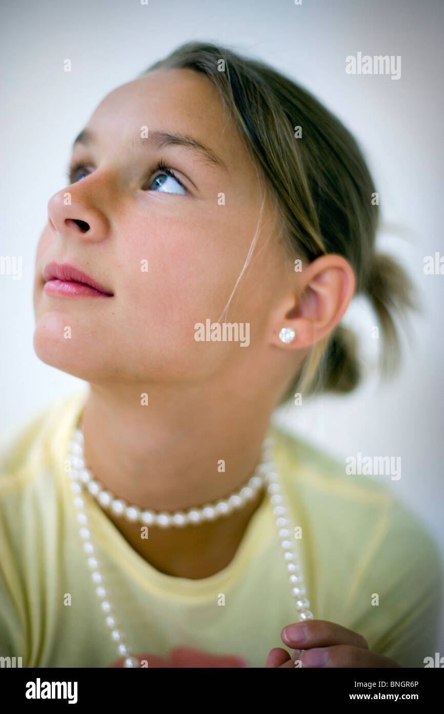 Girl wearing pearl necklace Stock Photo - Alamy