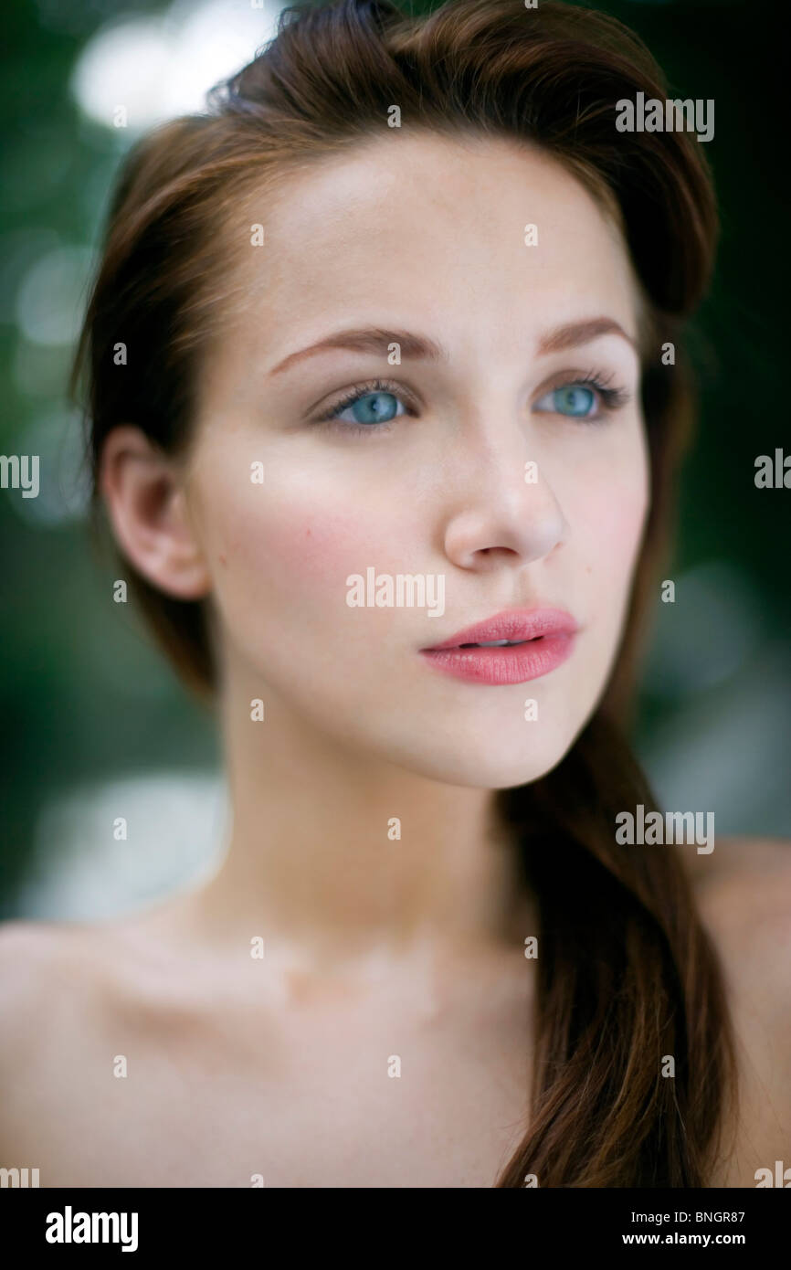 Young woman looking up Stock Photo - Alamy