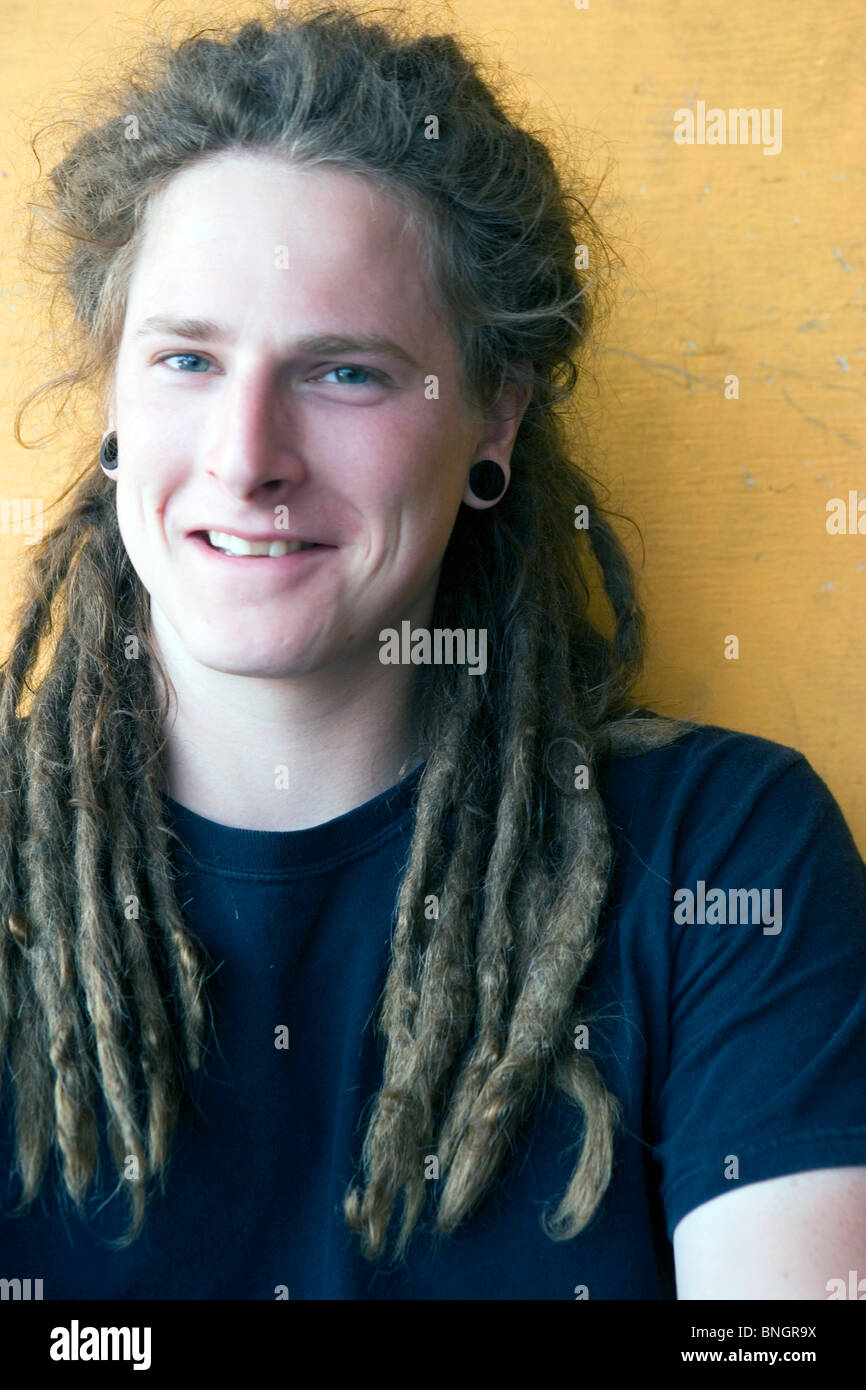 Portrait of young man with dreadlocks Stock Photo - Alamy