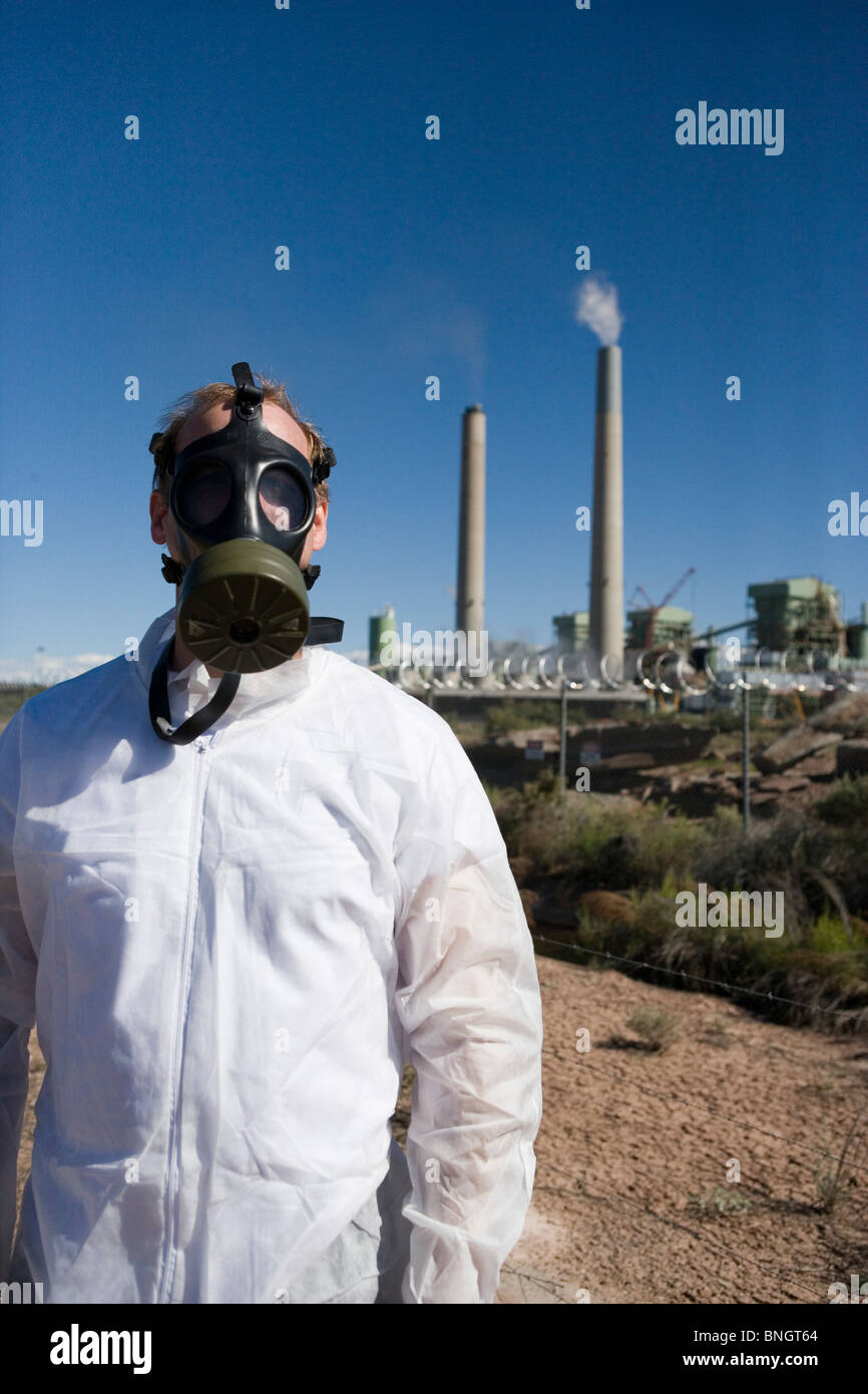 Man wearing gas mask in front of coal mine refinery Stock Photo - Alamy