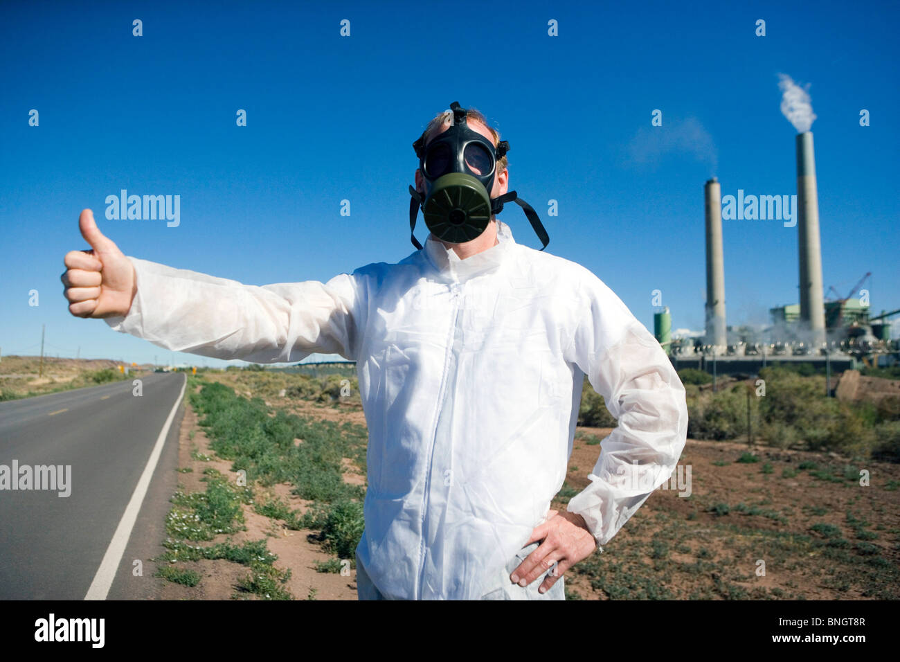 Man in gas mask in front of a coal mine refinery Stock Photo - Alamy
