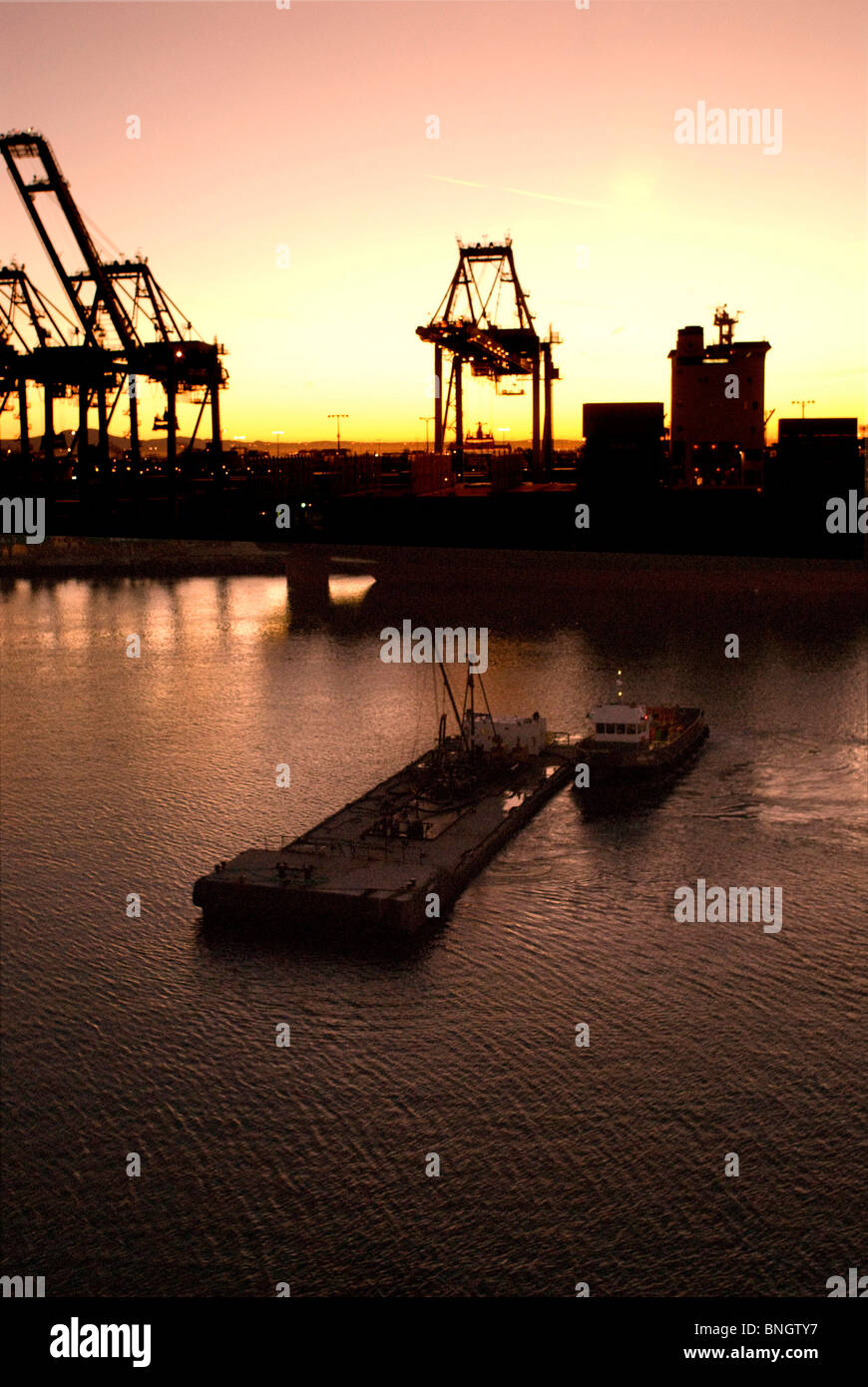 Tugboat moving barge at sunrise, Long Beach, CA, USA Stock Photo - Alamy