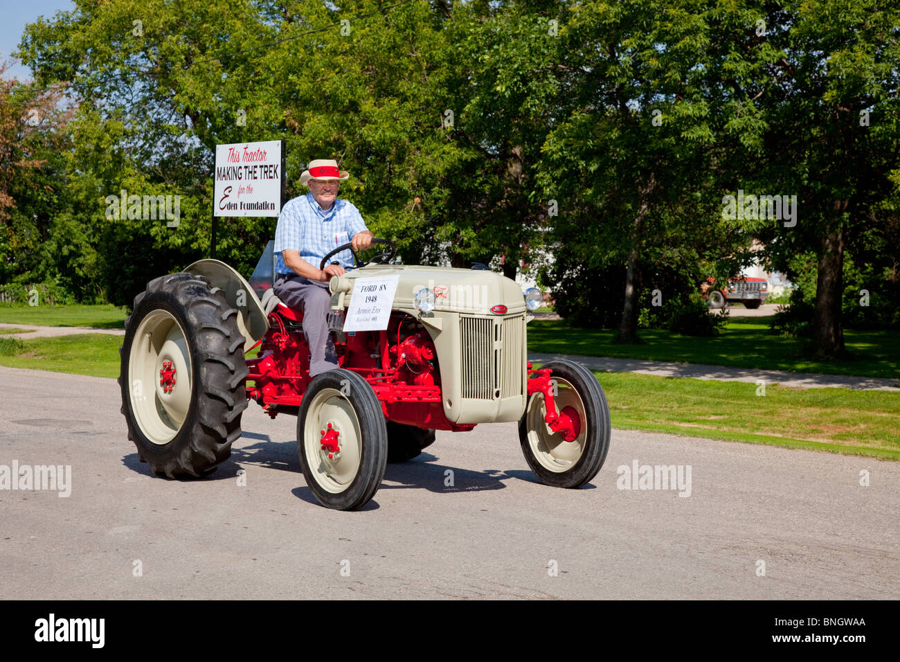 A procession of antique tractors at the 2010 Tractor Trek in Reinland ...