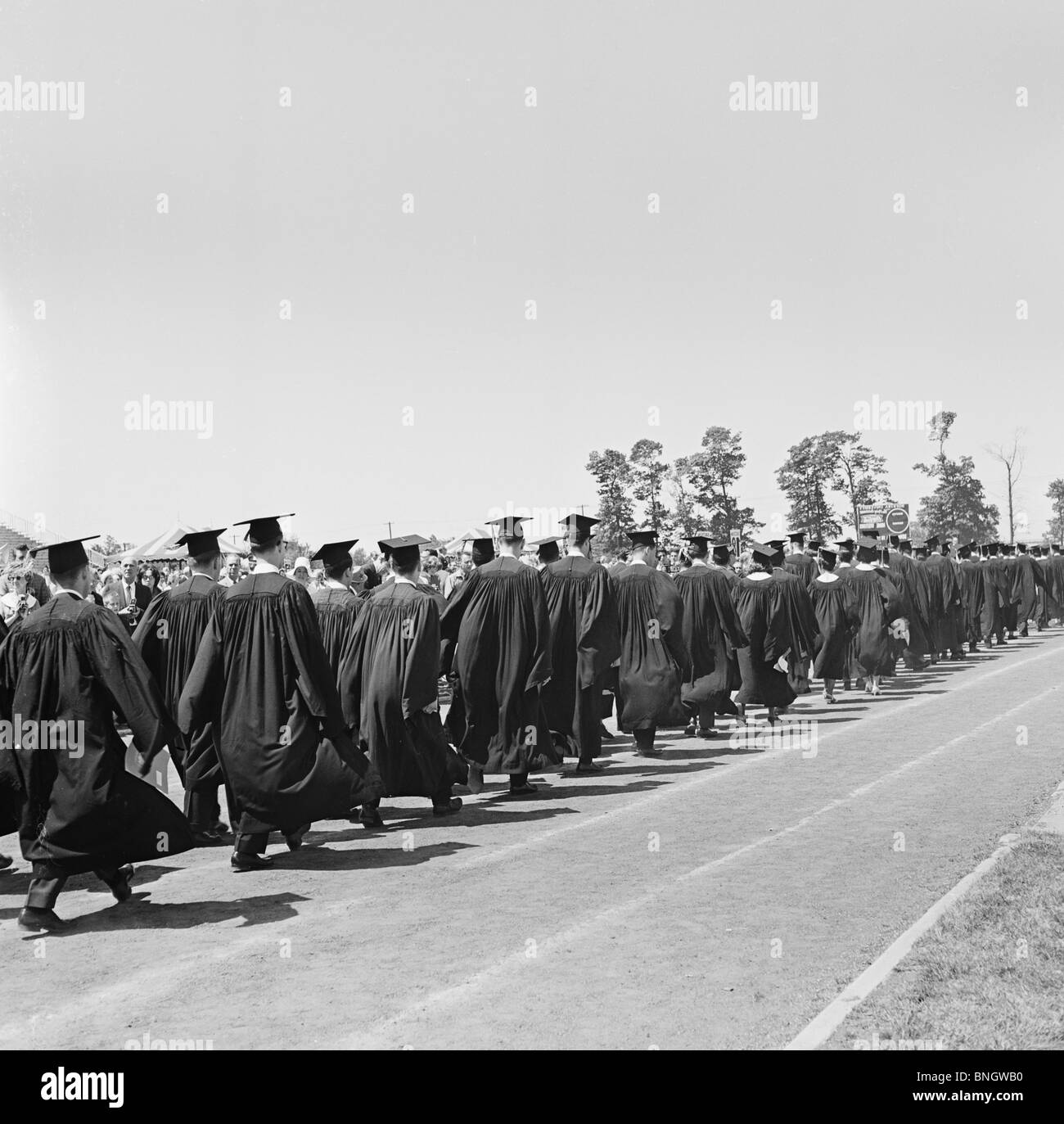 Men walking in line Black and White Stock Photos & Images - Alamy