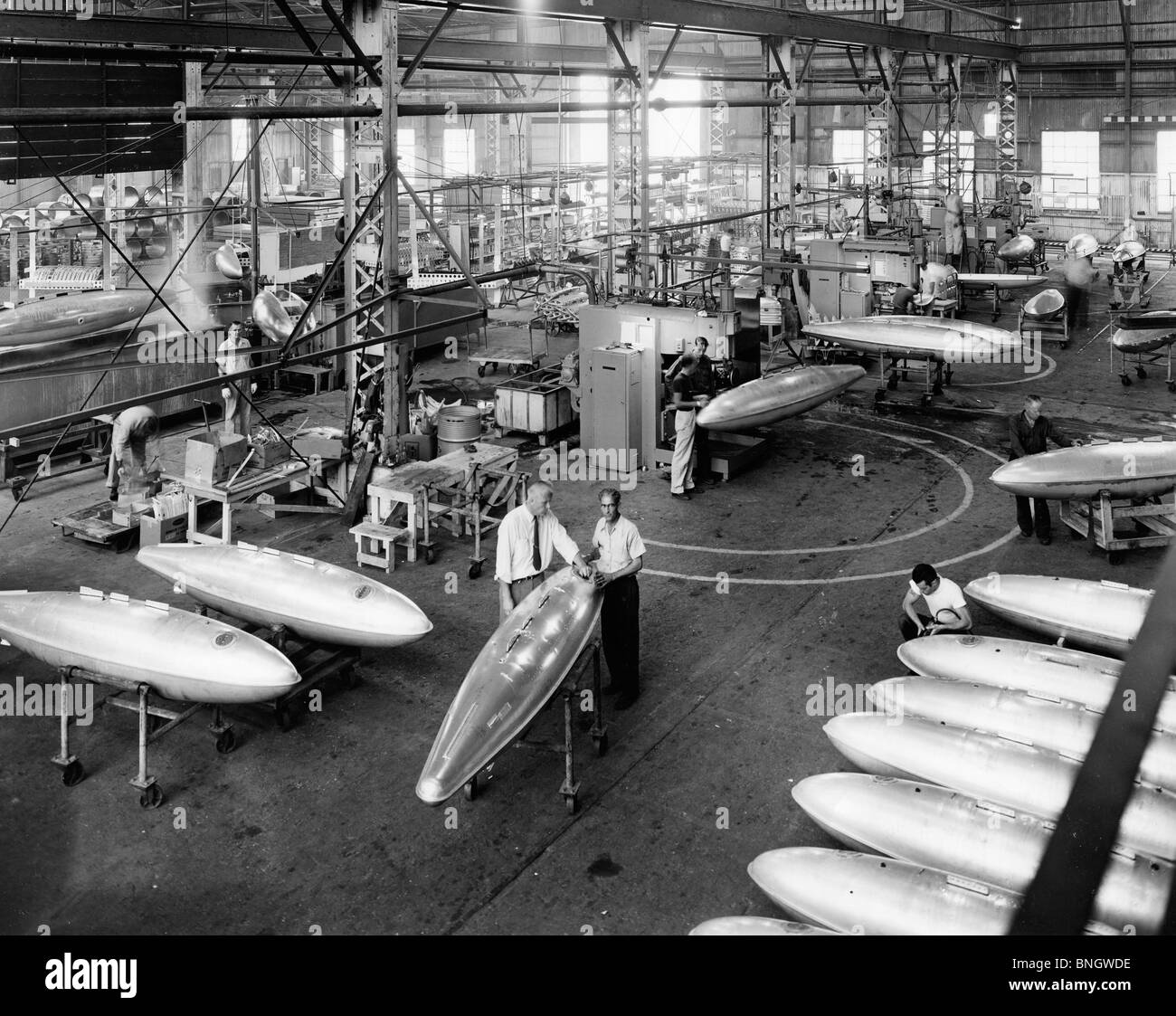 Technicians manufacturing fuel tanks for fighter planes Stock Photo - Alamy