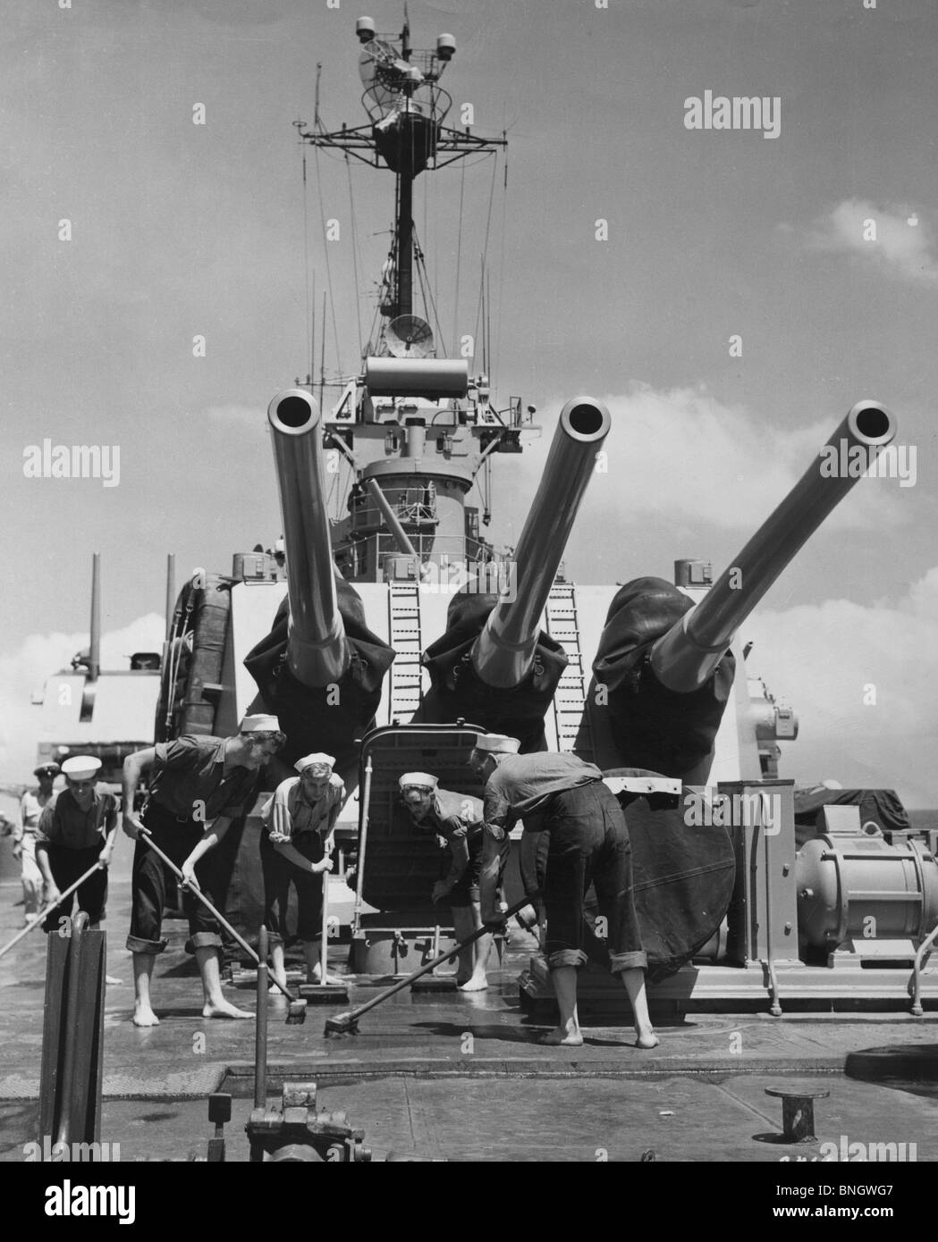 Sailors cleaning the deck of US Navy Cruiser, 1960s Stock Photo - Alamy